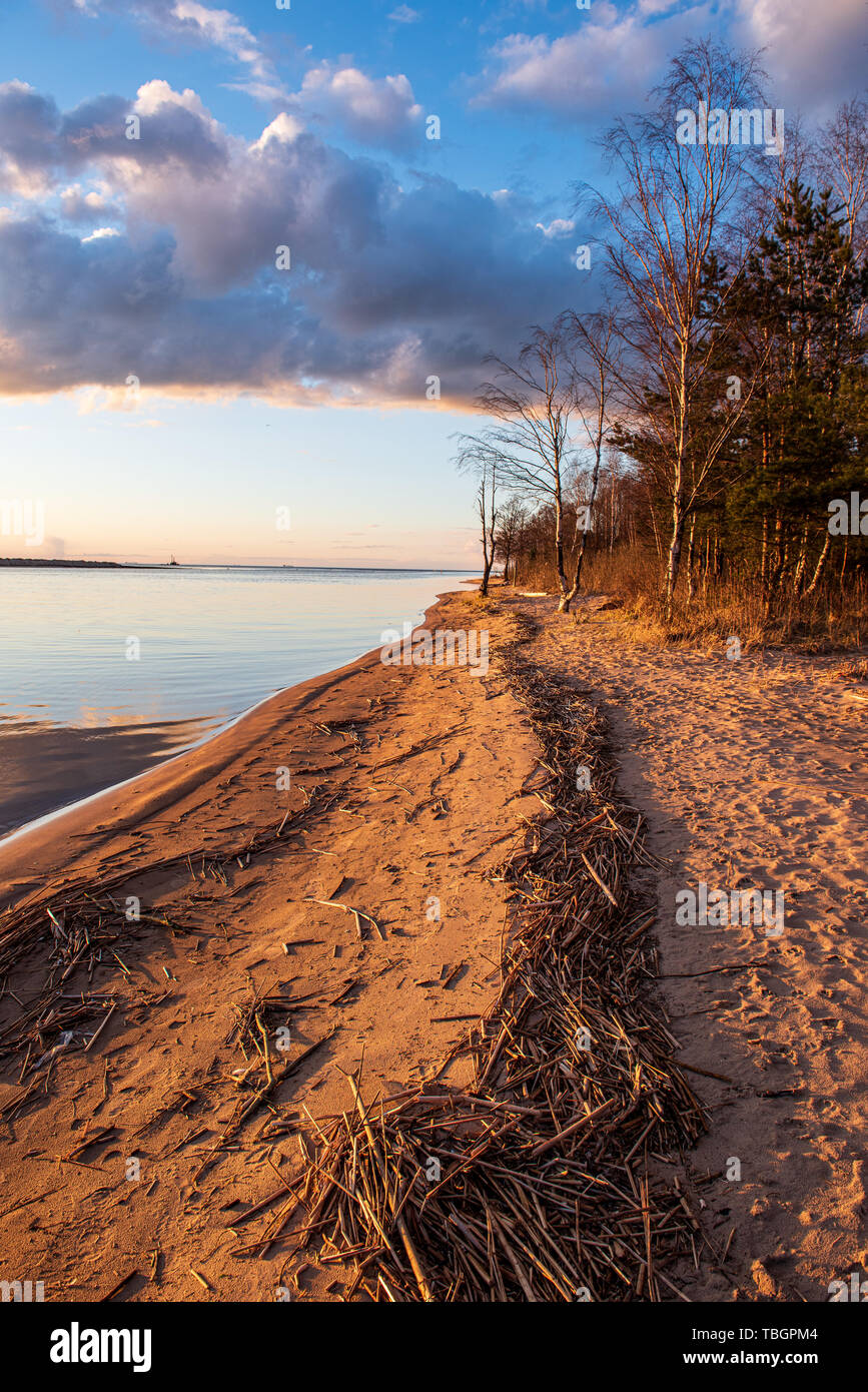 calm countryside lake river with cloud reflections in water and green ...