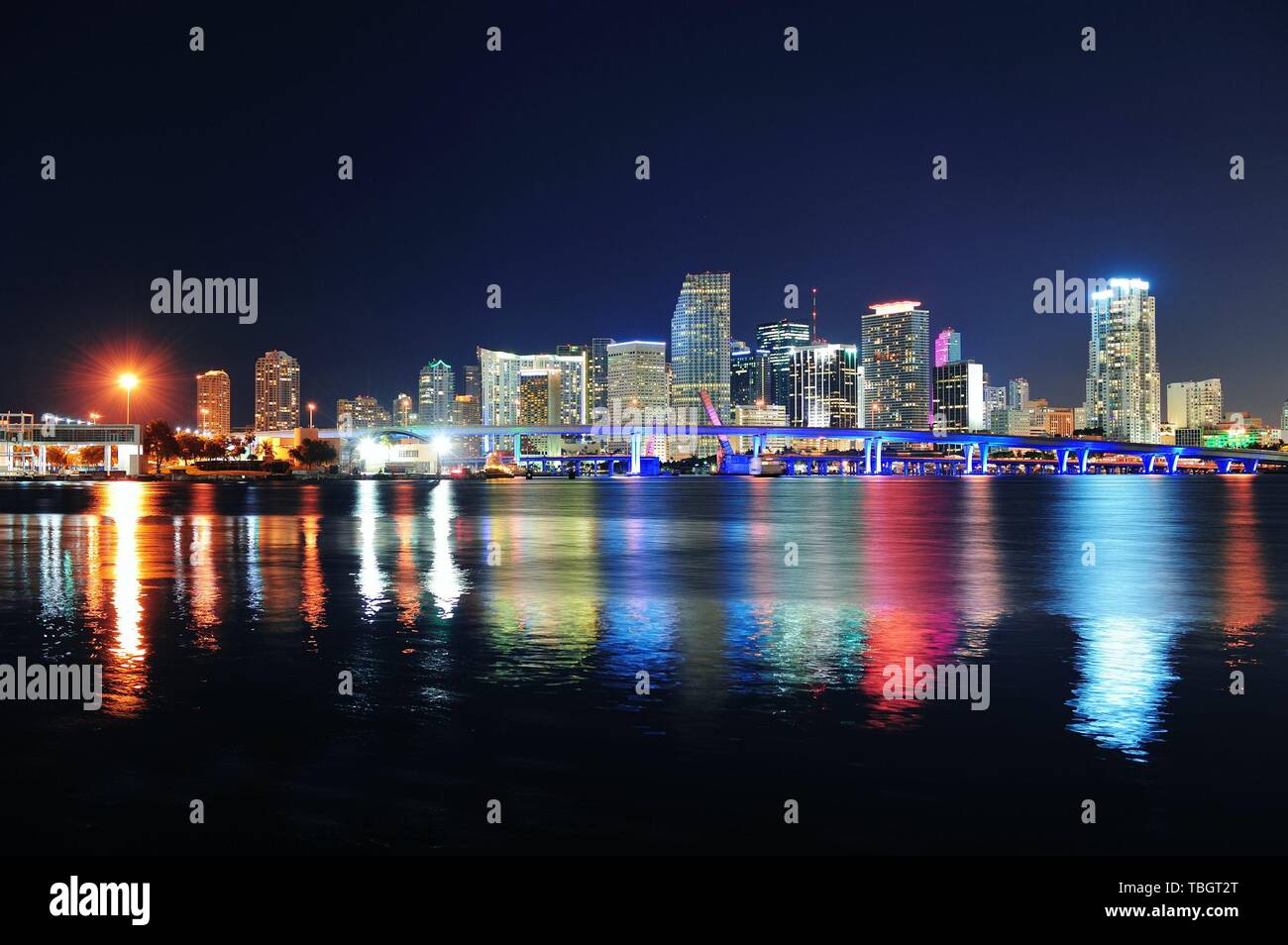 Miami city skyline panorama at dusk with urban skyscrapers and bridge ...