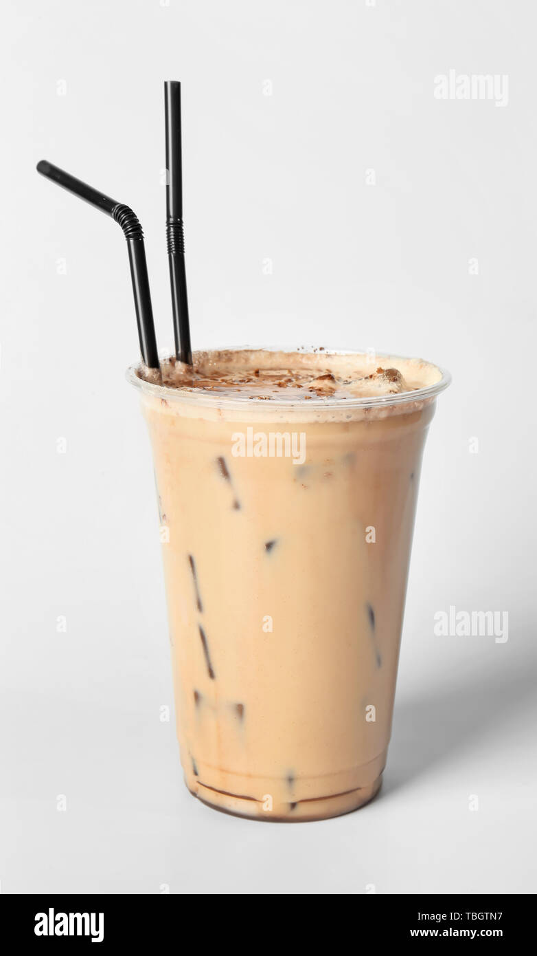 Cup of tasty frappe coffee on light background Stock Photo - Alamy