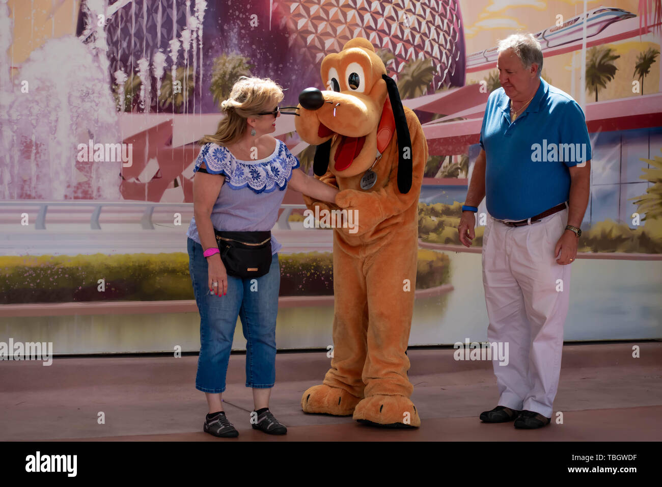 Orlando, Florida . March 27, 2019. Pluto taking the hands of senior ...