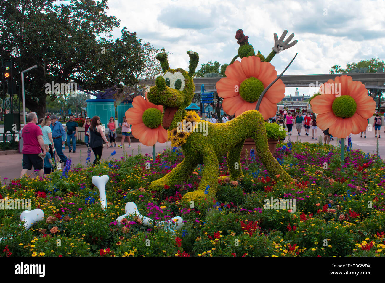 Orlando, Florida . March 27, 2019. Pluto topiarie in colorful scenery ...