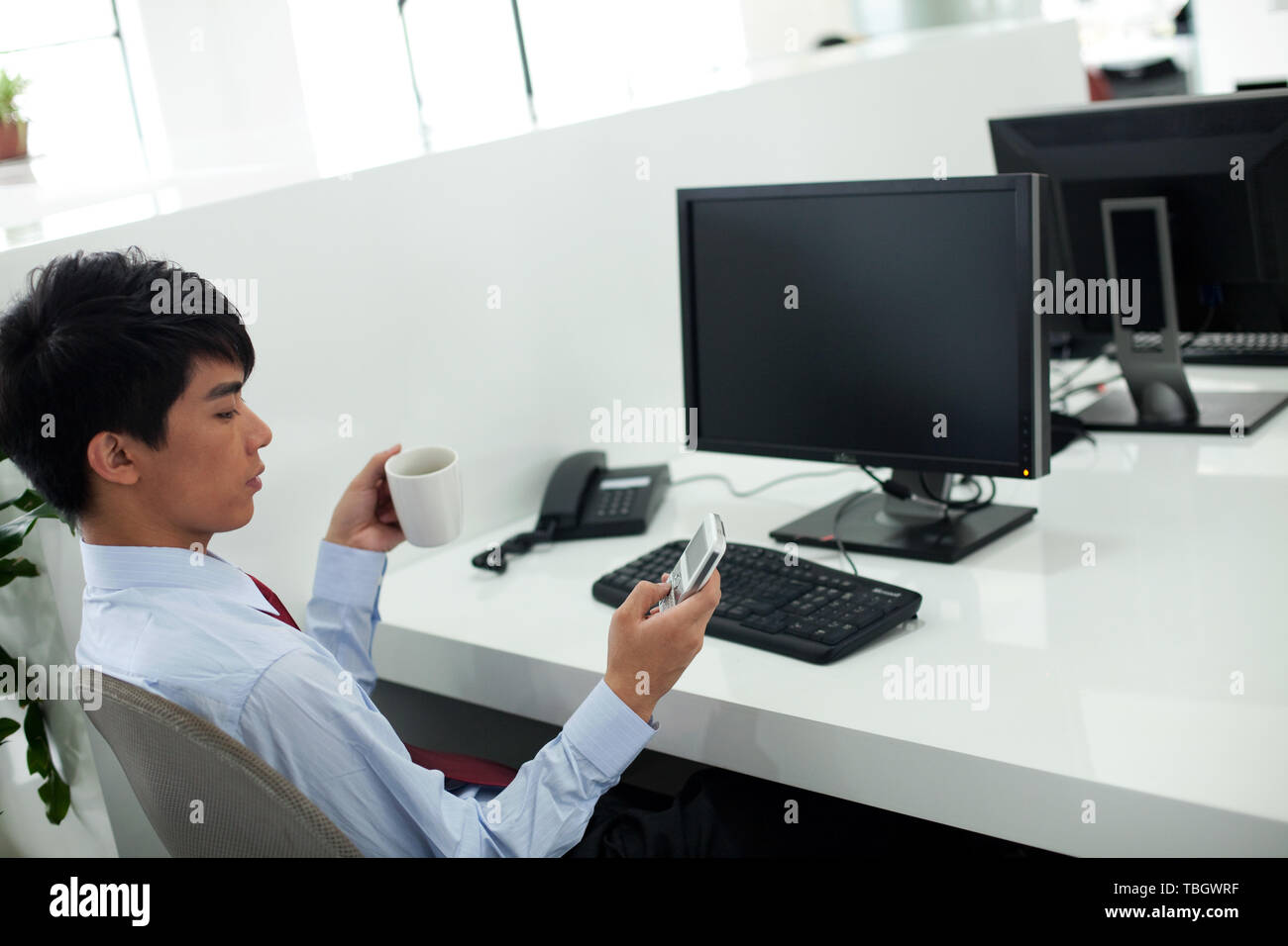 A white-collar man in front of a computer Stock Photo - Alamy