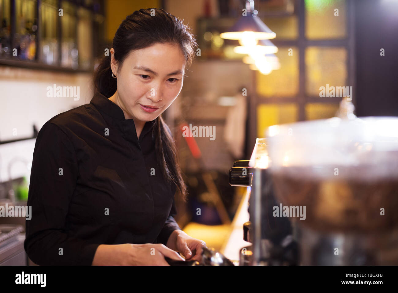 waitress serving in modern cafe Stock Photo - Alamy