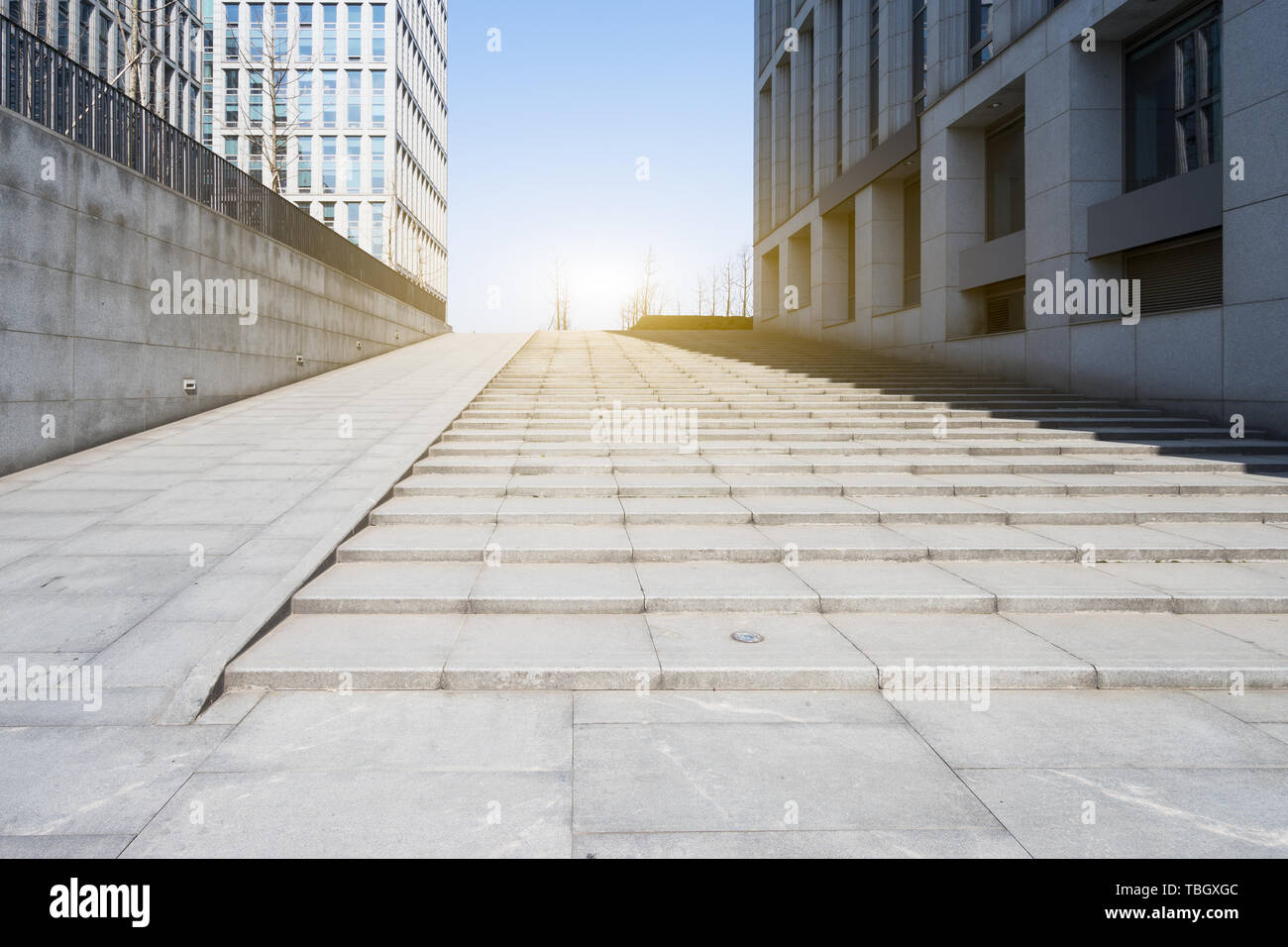 empty footpath between modern building with sunbeam Stock Photo - Alamy