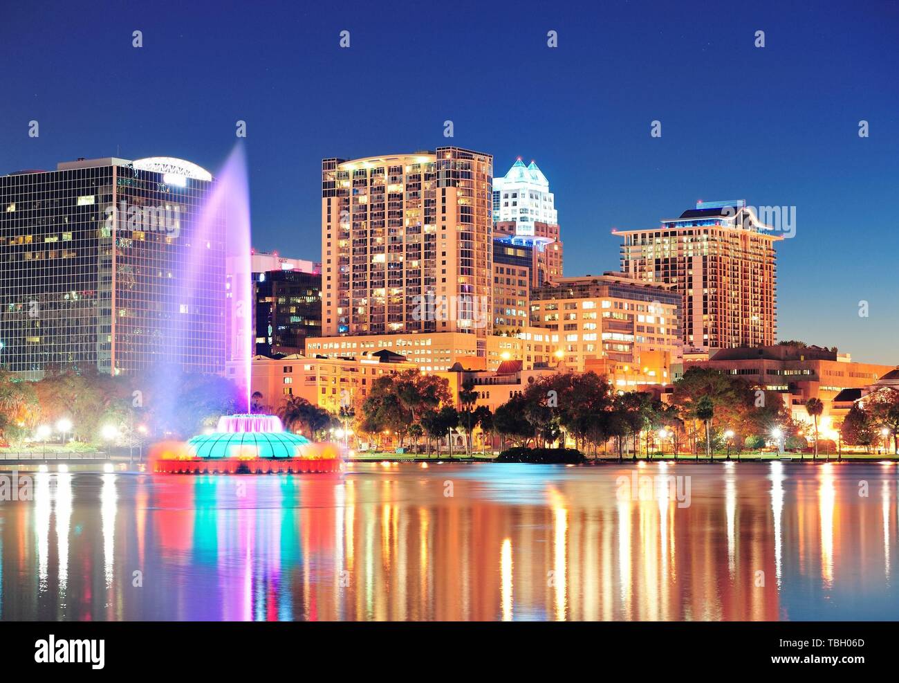 Orlando downtown skyline panorama over Lake Eola at night with urban ...
