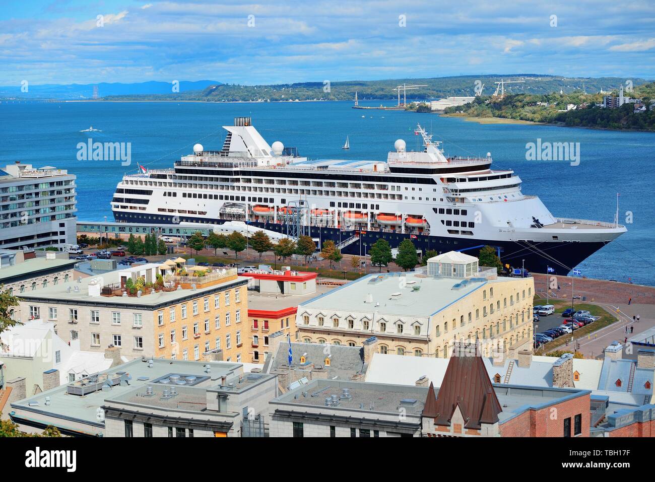 Cruise ship in river in Quebec City with blue sky and historical ...