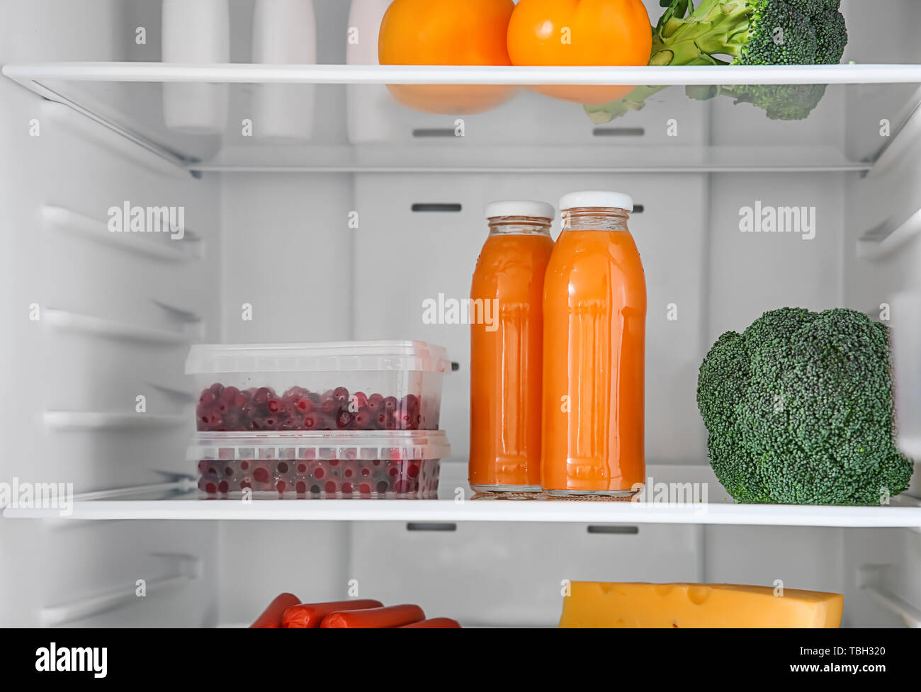 Open fridge full of different food Stock Photo - Alamy