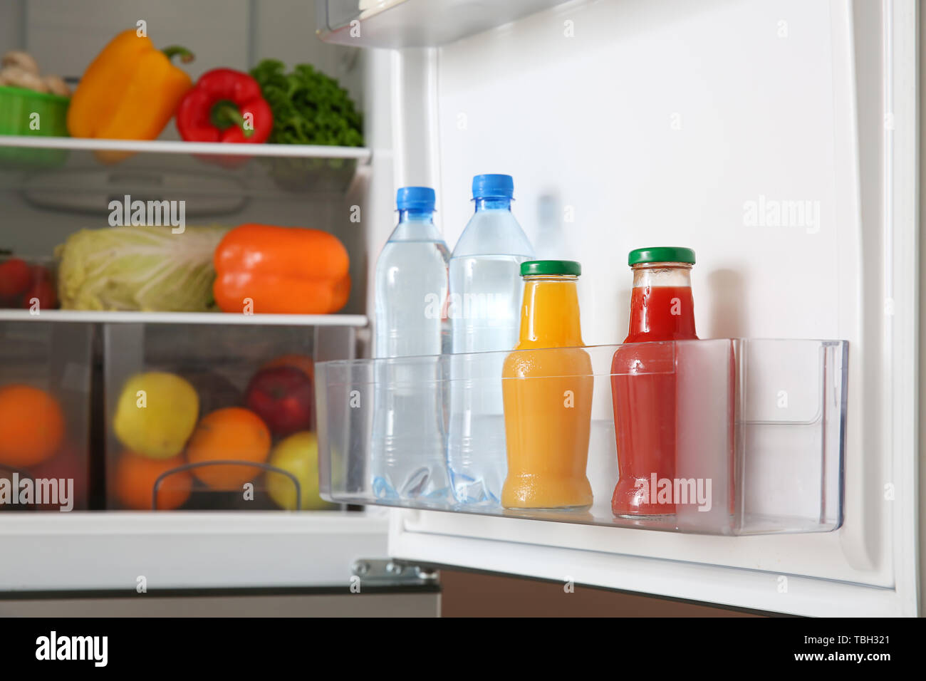 Open fridge full of different food Stock Photo - Alamy