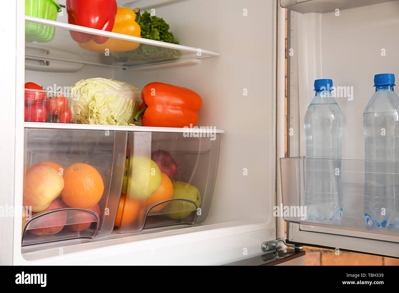 Open fridge full of different food Stock Photo - Alamy