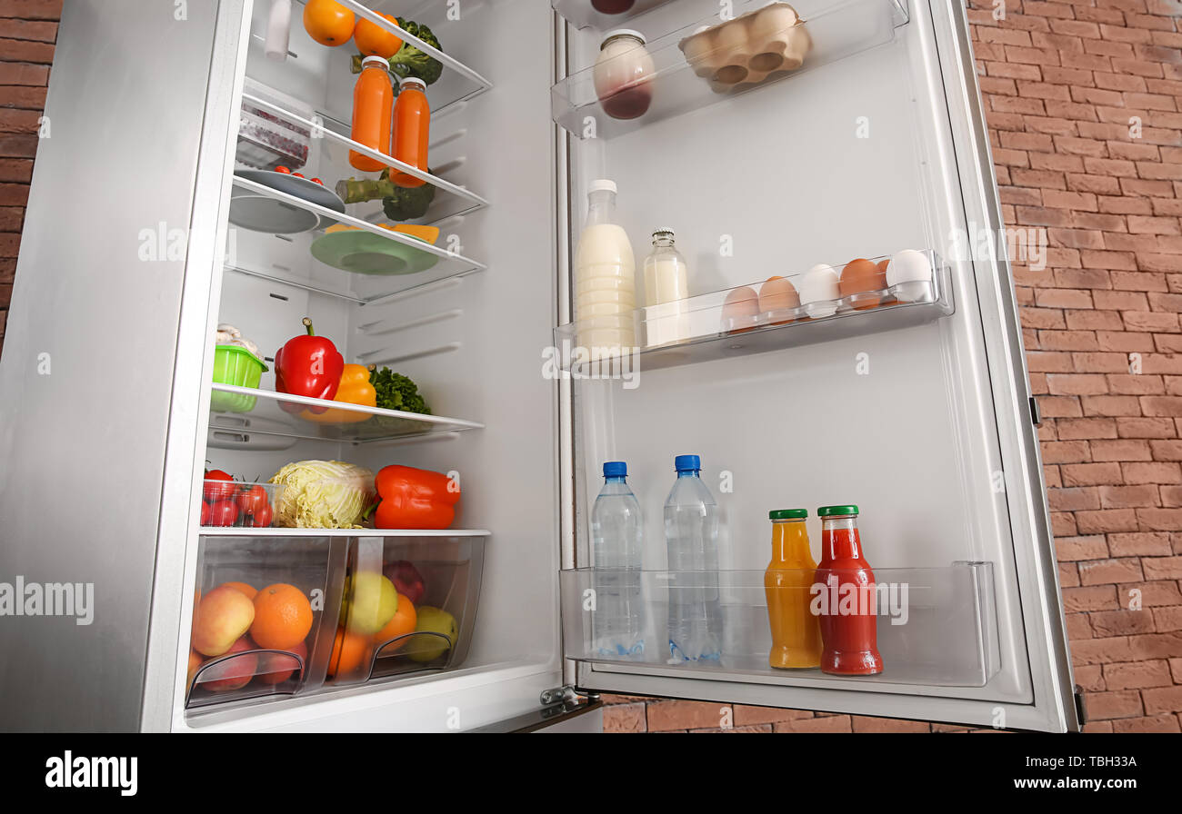 Open fridge full of different food Stock Photo - Alamy