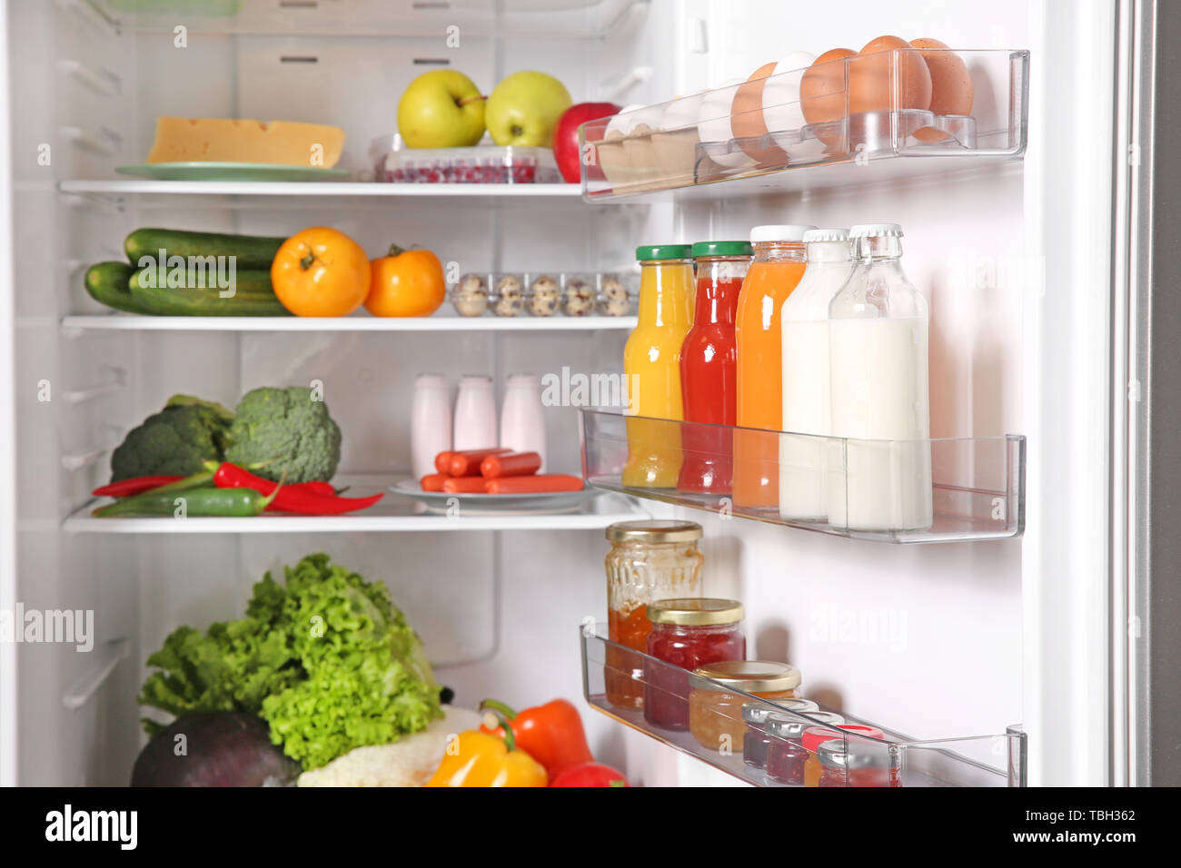 Open fridge full of different food Stock Photo - Alamy