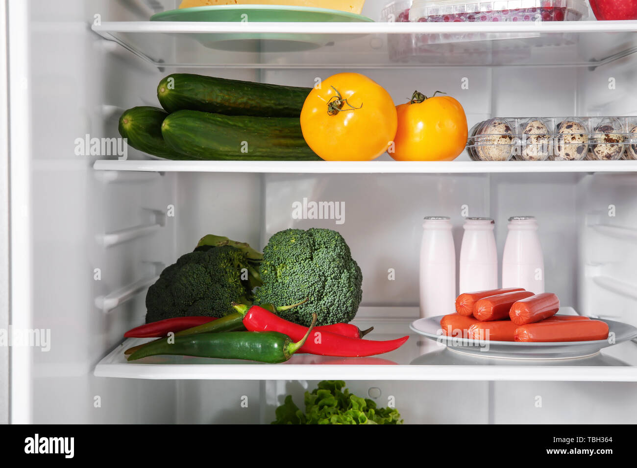 Open fridge full of different food Stock Photo - Alamy