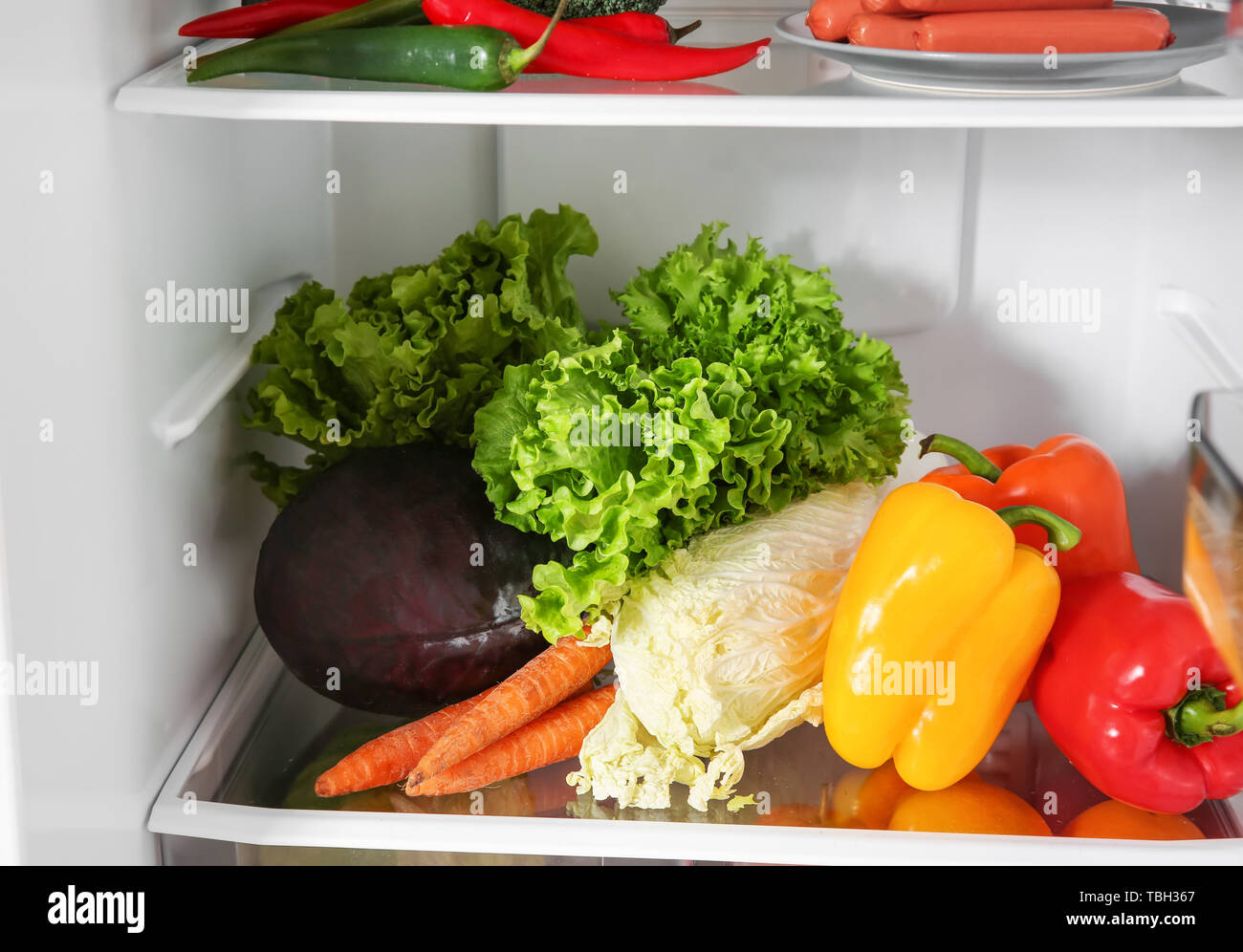 Open fridge full of different food Stock Photo - Alamy
