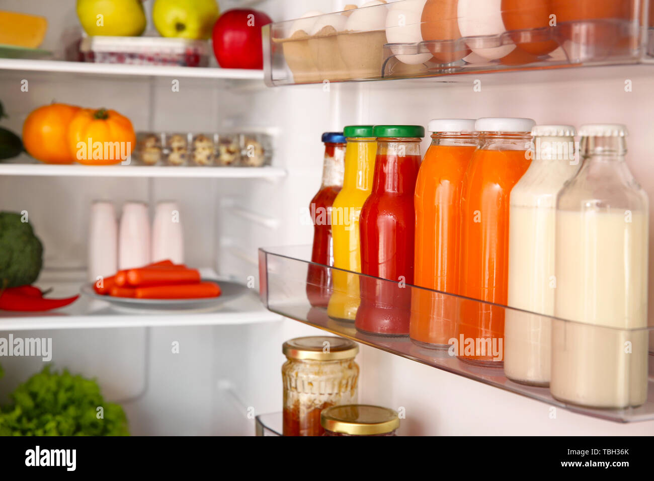 Open fridge full of different food Stock Photo - Alamy