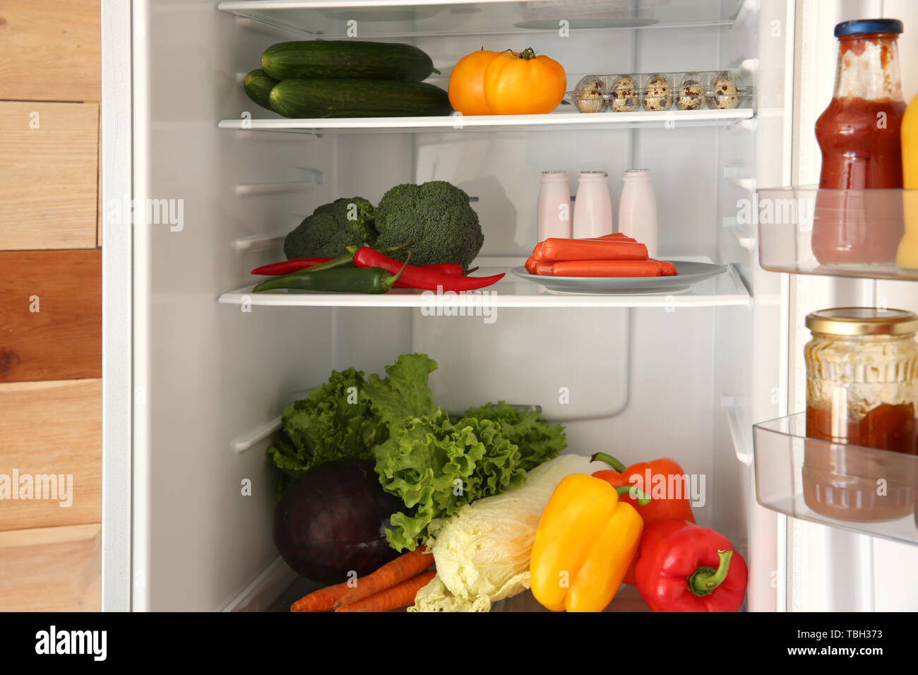 Open fridge full of different food Stock Photo - Alamy