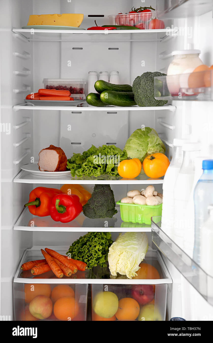 Open fridge full of different food Stock Photo - Alamy