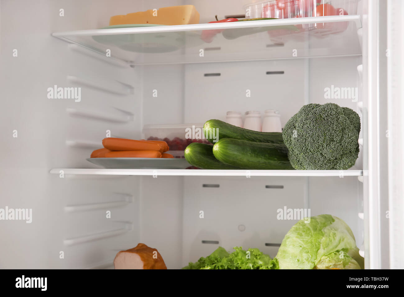Open fridge full of different food Stock Photo - Alamy
