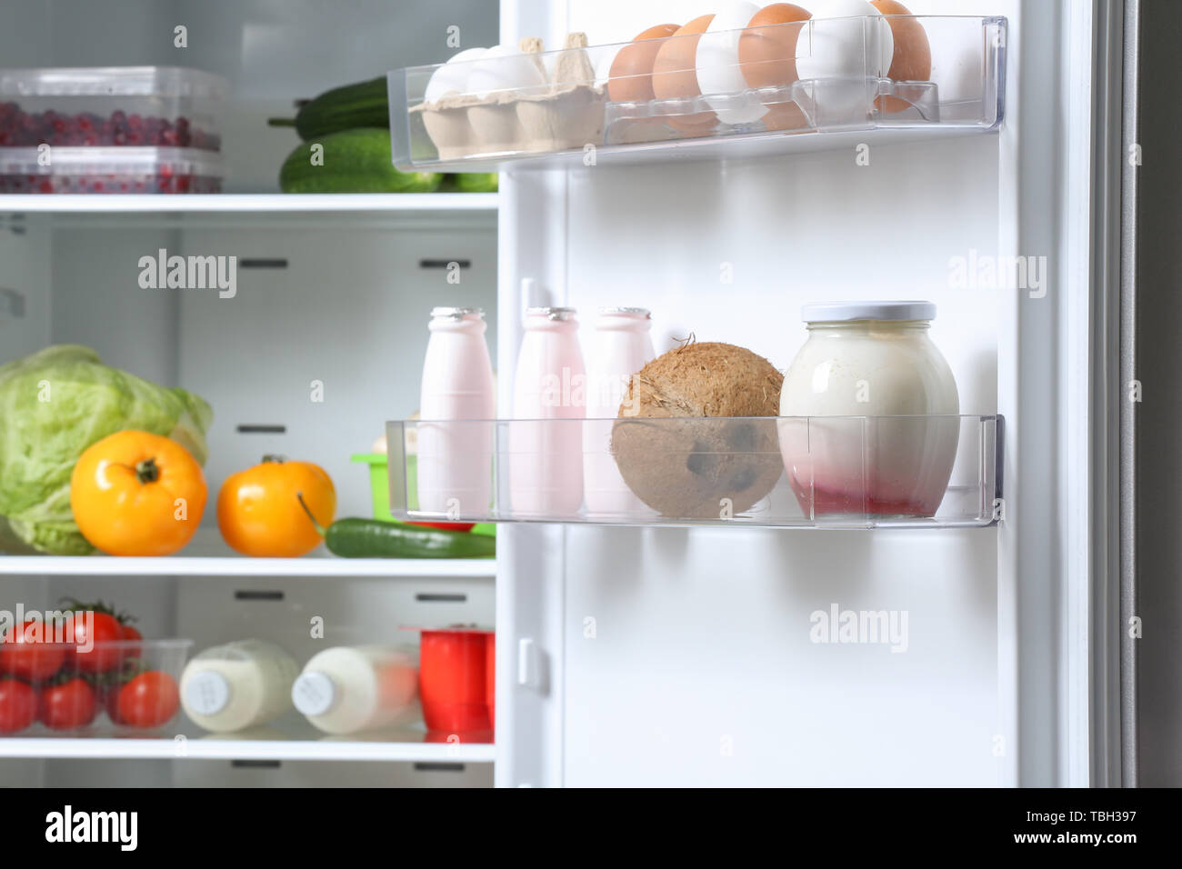 Open fridge full of different food Stock Photo - Alamy