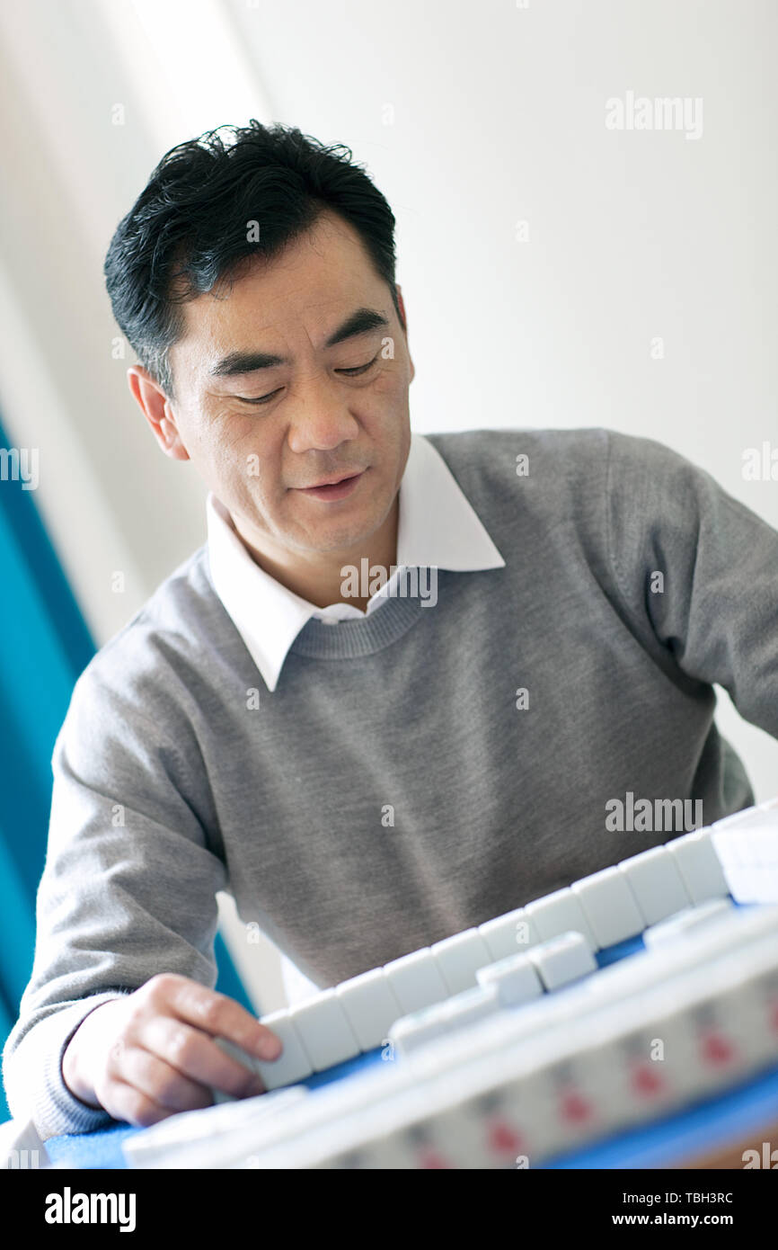 Old people play mahjong Stock Photo - Alamy