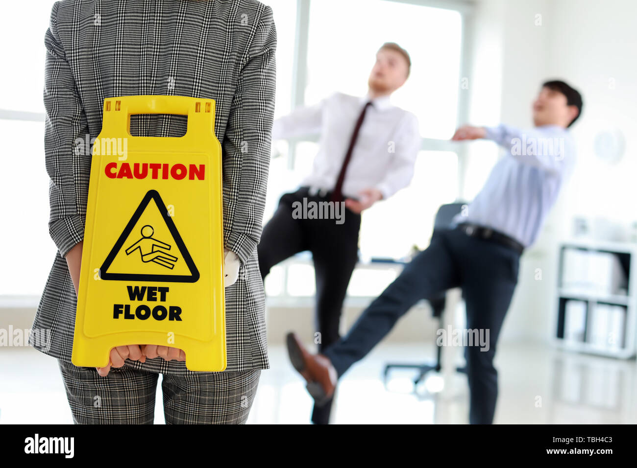 Woman playing a prank on her colleagues in office.April Fools' Day ...