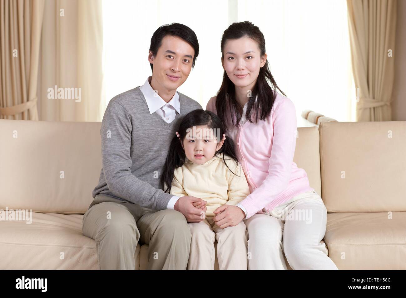 family of three Stock Photo - Alamy