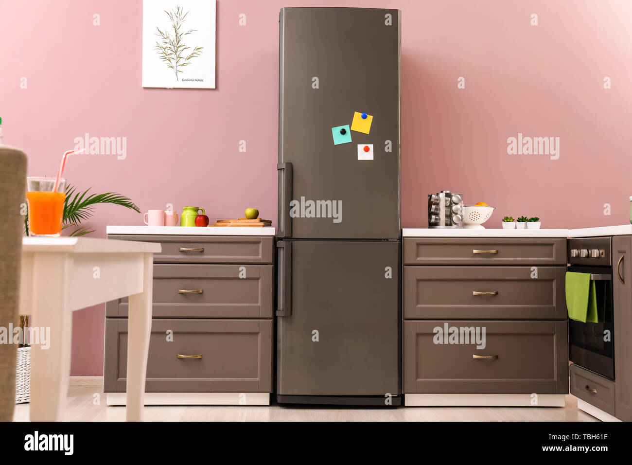 Big modern fridge in interior of kitchen Stock Photo - Alamy