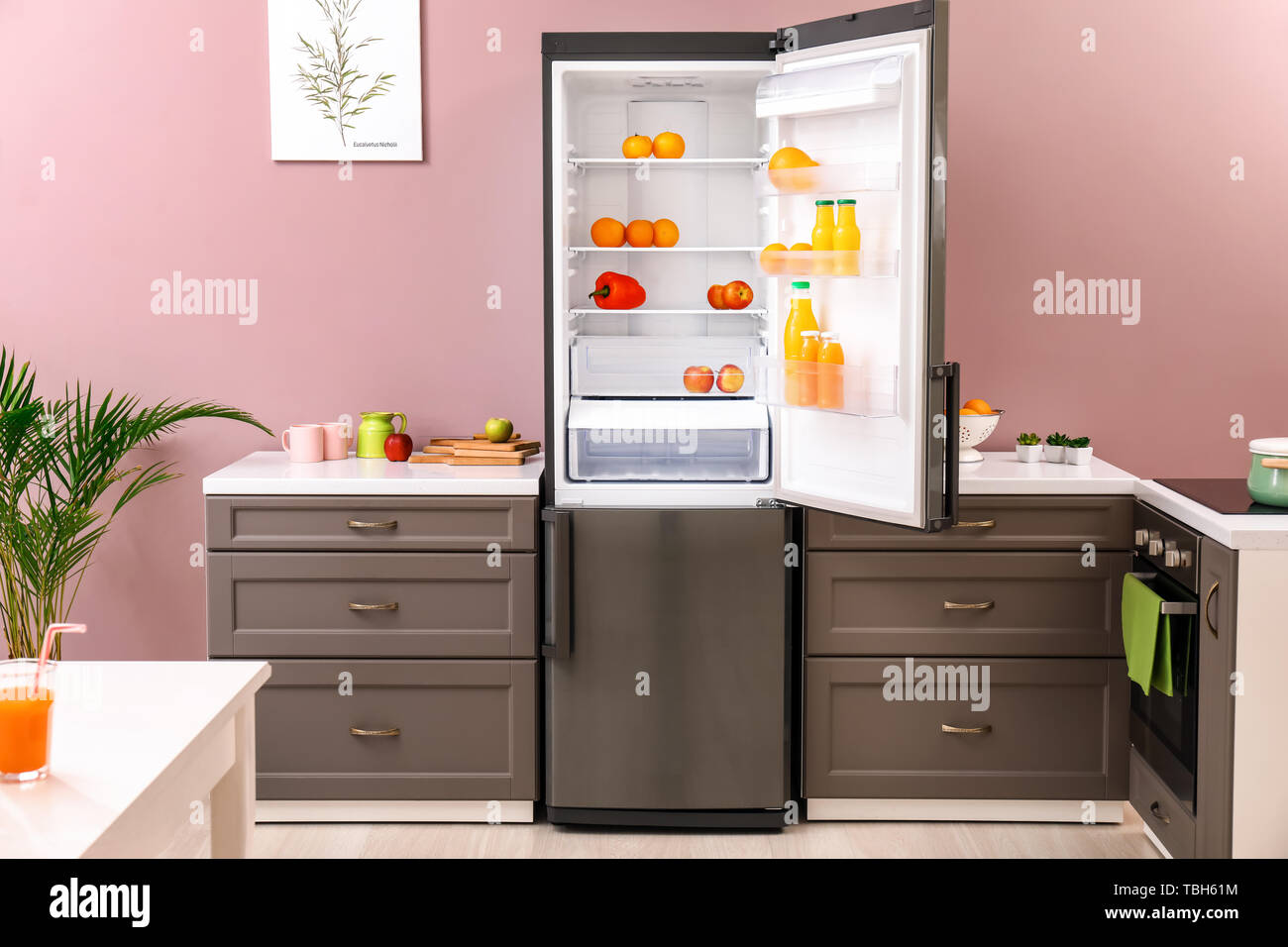 Big modern fridge in interior of kitchen Stock Photo - Alamy