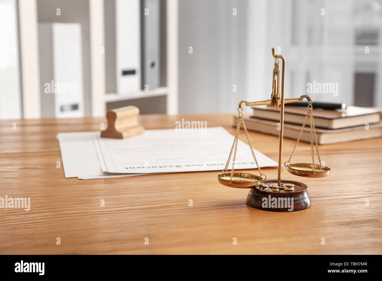 Scales of justice on table of notary public Stock Photo - Alamy