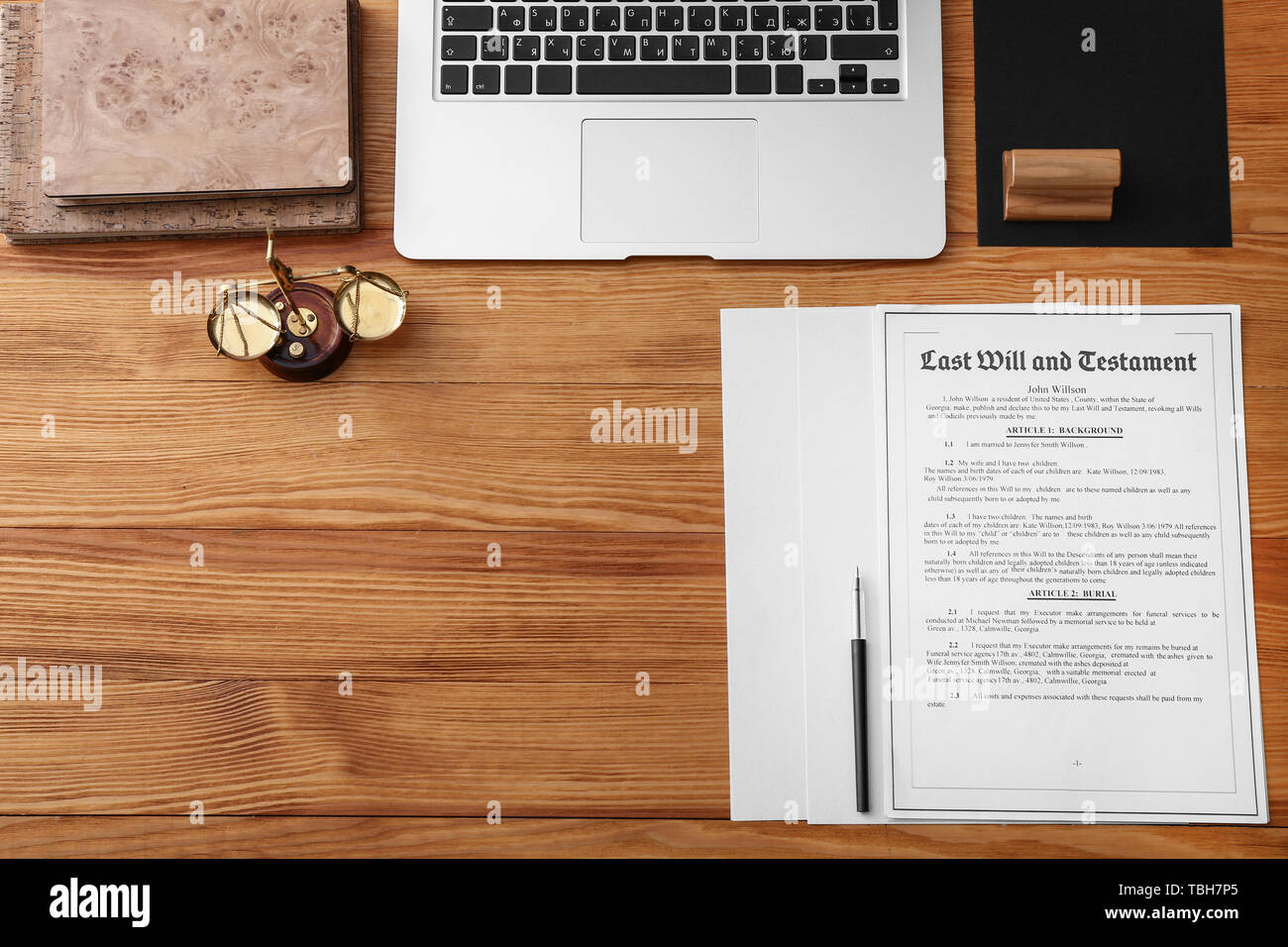 Document, stationery and laptop on table of notary public Stock Photo ...