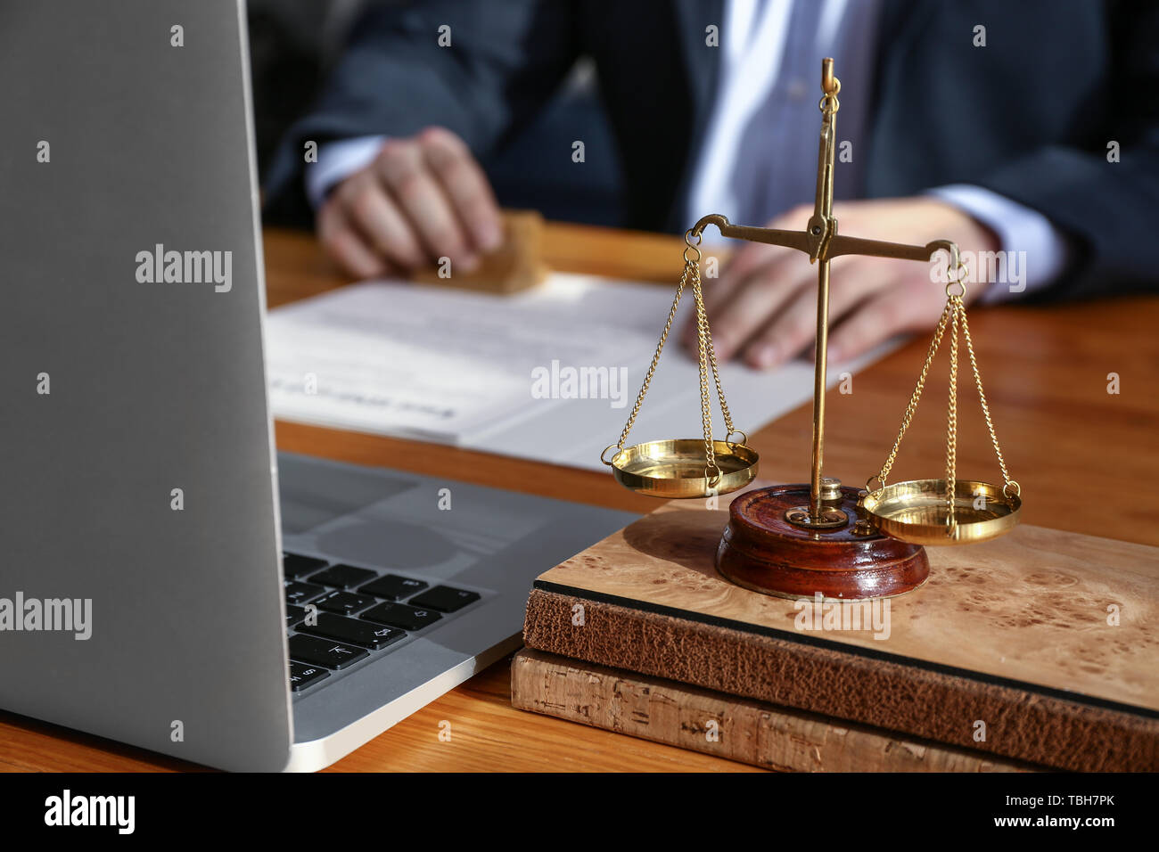 Scales of justice on table of notary public Stock Photo - Alamy