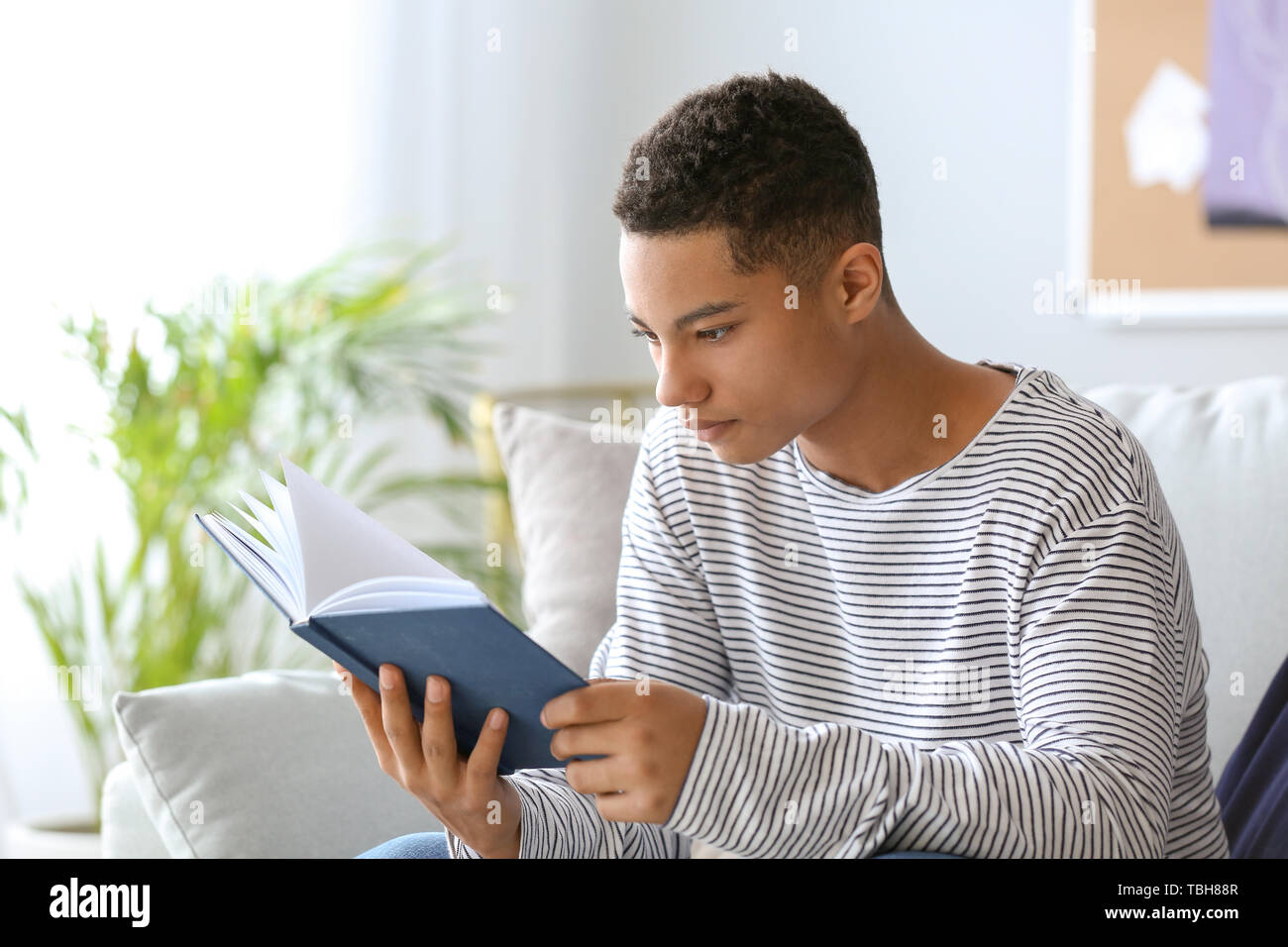 Teen Boy Reading A Book