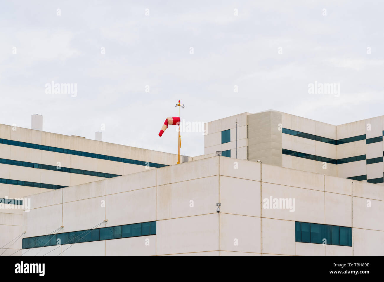 Air Wind Cone At Mast on a skyscraper near a heliport to indicate wind ...
