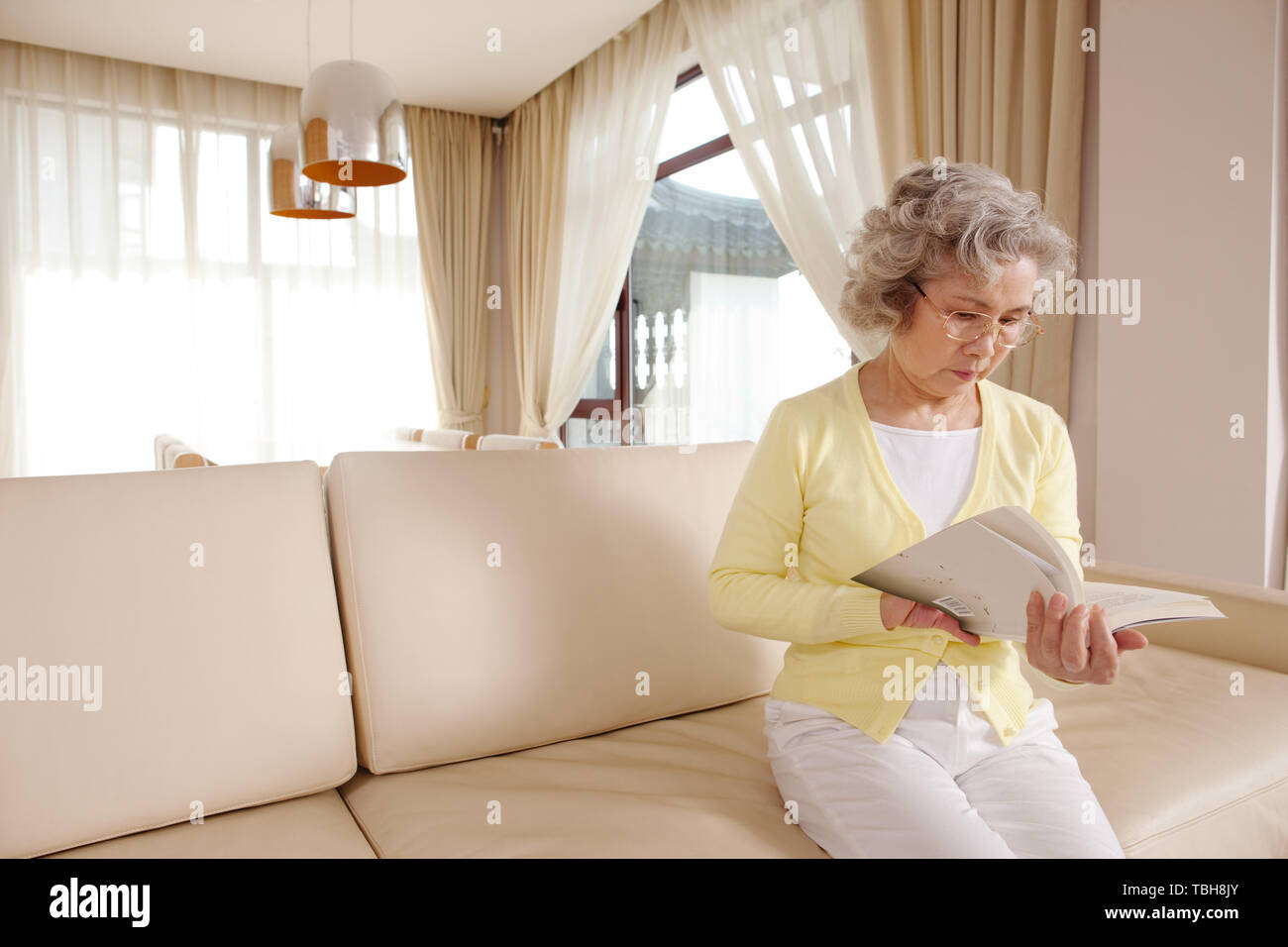 The elderly read books and enjoy their old age Stock Photo - Alamy