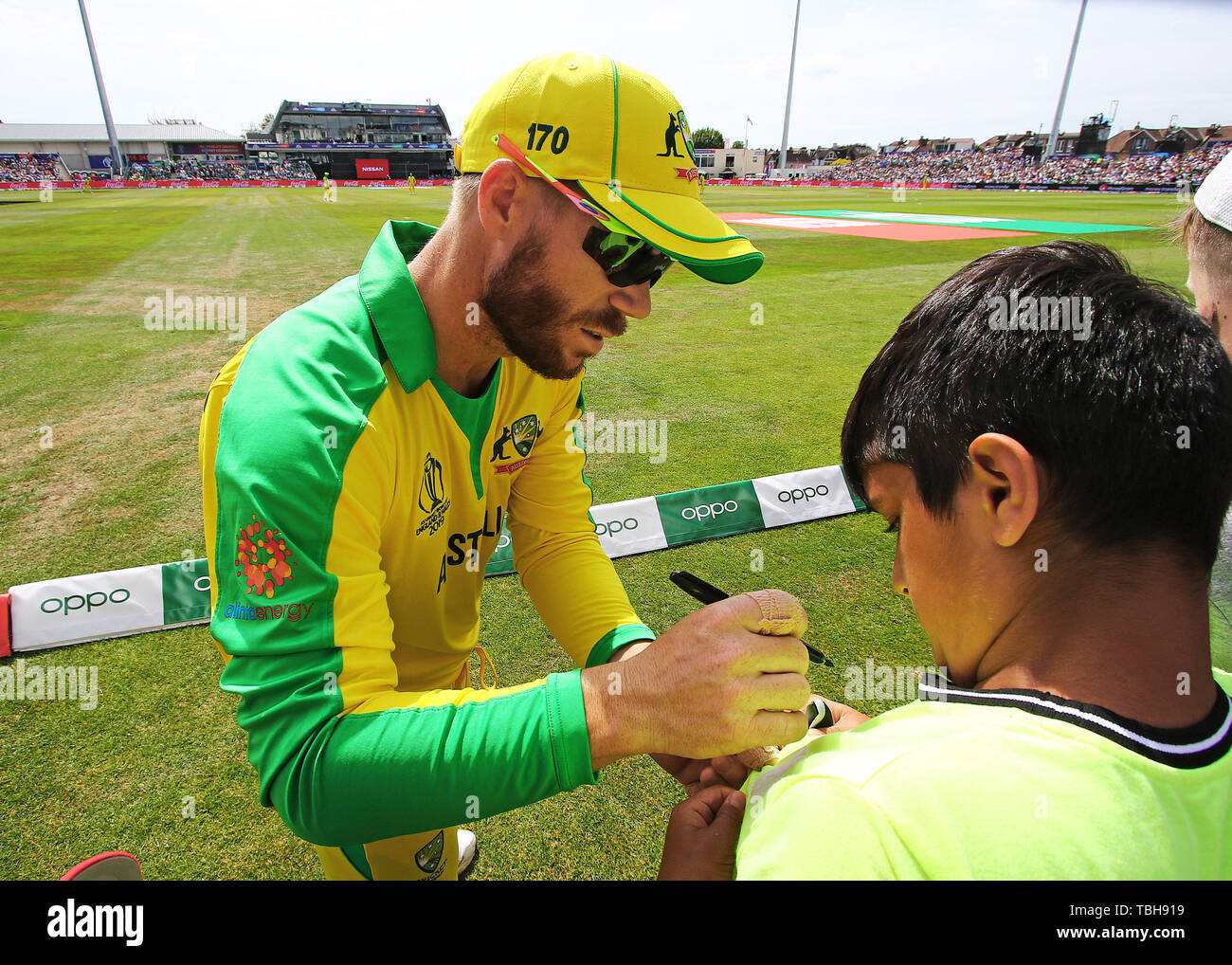 Australia's David Warner signs autographs during the ICC Cricket World ...
