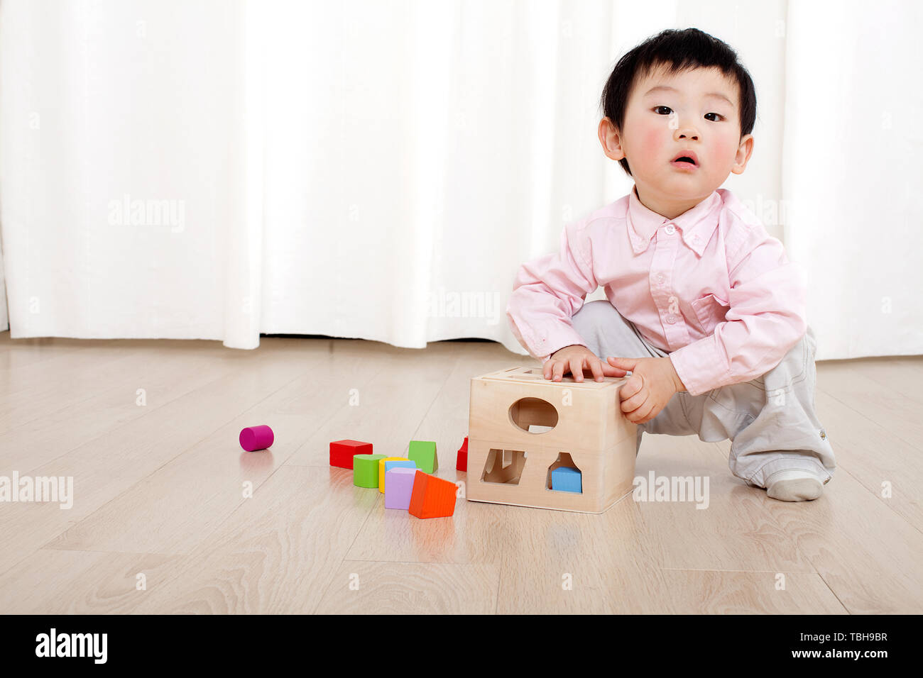 A child acquires knowledge in a game Stock Photo - Alamy