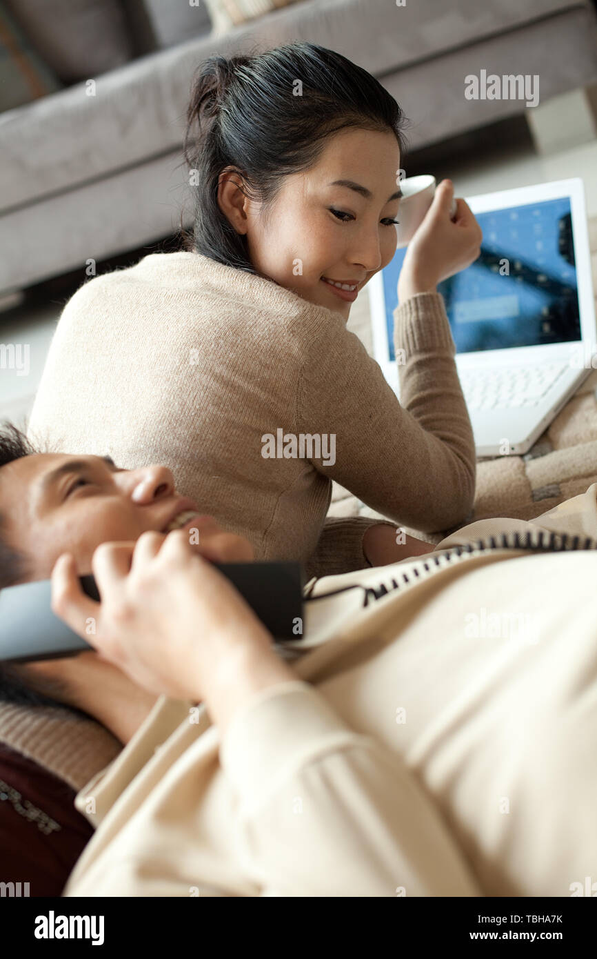 A couple snuggled up together Stock Photo - Alamy