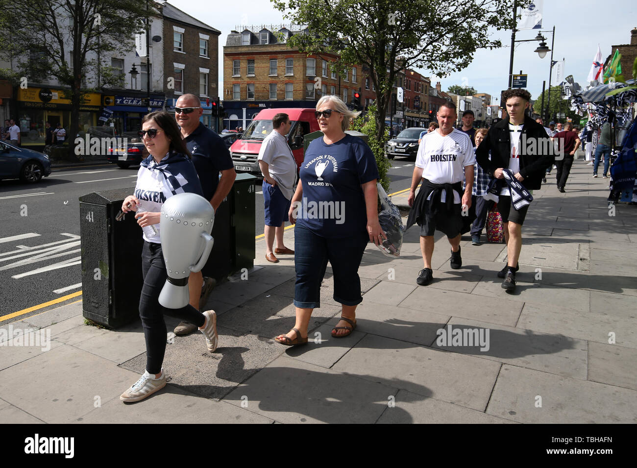 Tottenham Hotspur fans make their way to Tottenham Hotspur to watch a ...