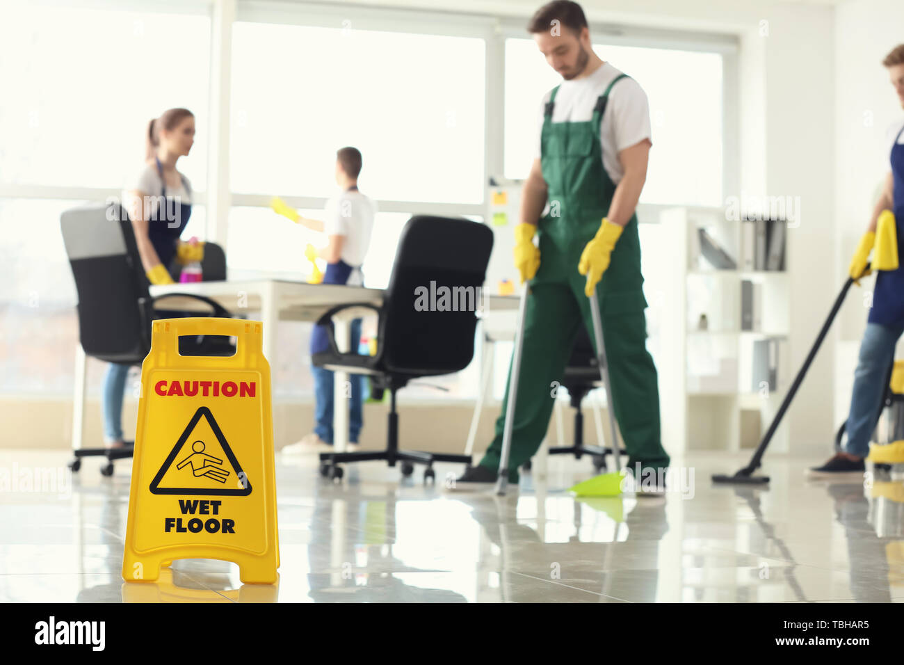 Sign board on floor in office during cleaning Stock Photo - Alamy