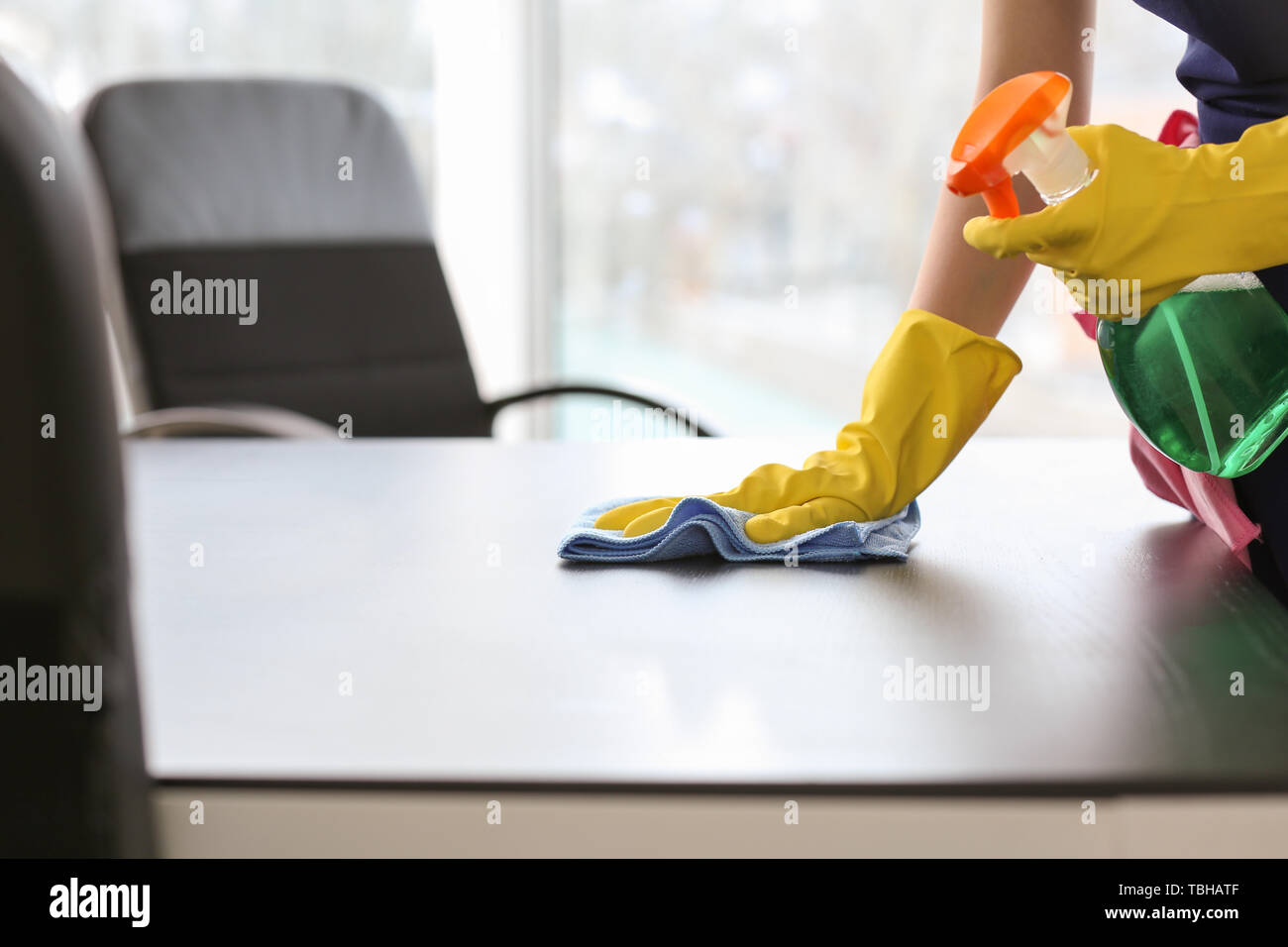 Female janitor cleaning table hi-res stock photography and images - Alamy