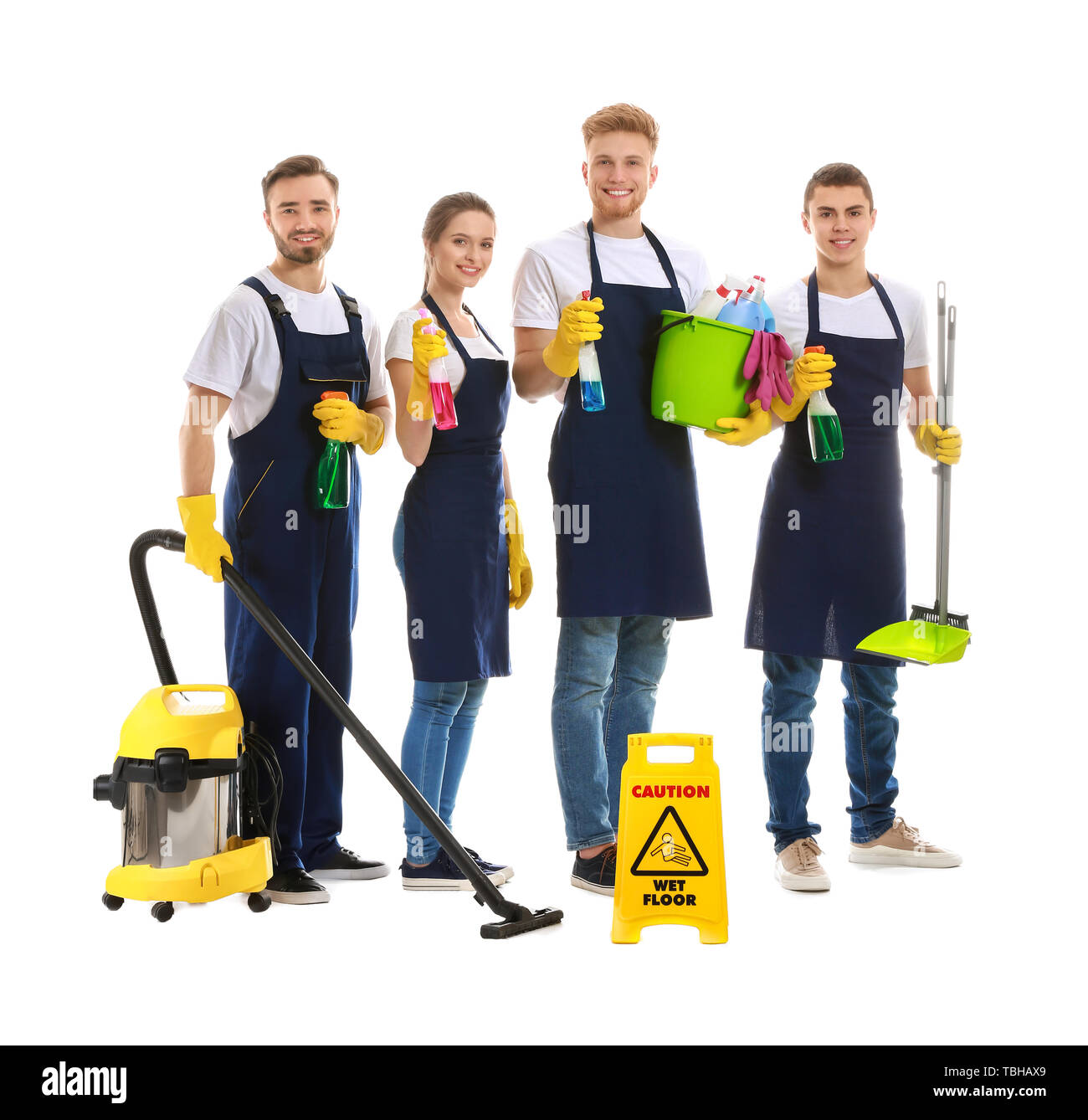Team of janitors with cleaning supplies on white background Stock Photo ...