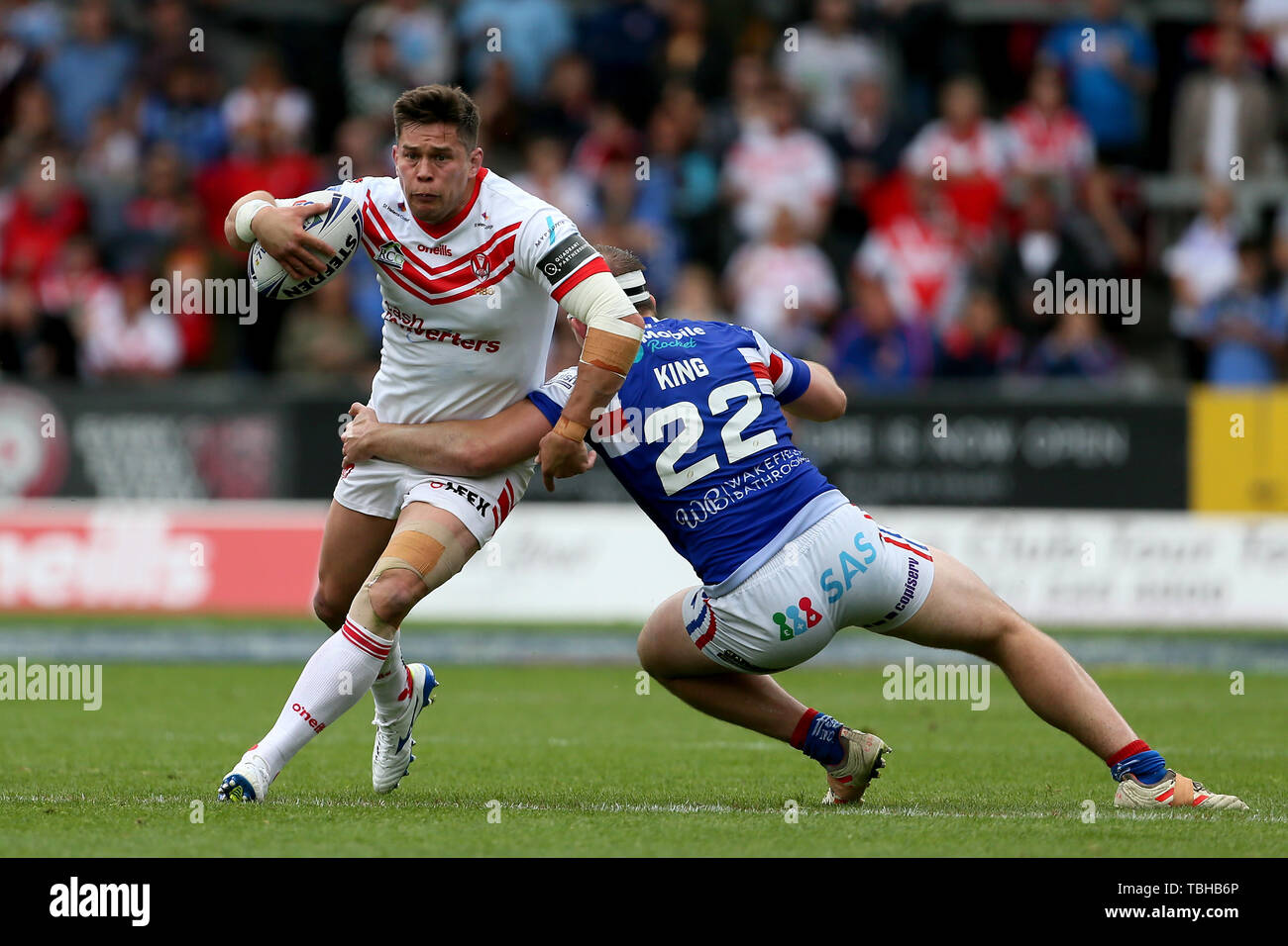 Saint Helens Louie McCarthy-Scarsbrook and Wakefield Trinity's George ...
