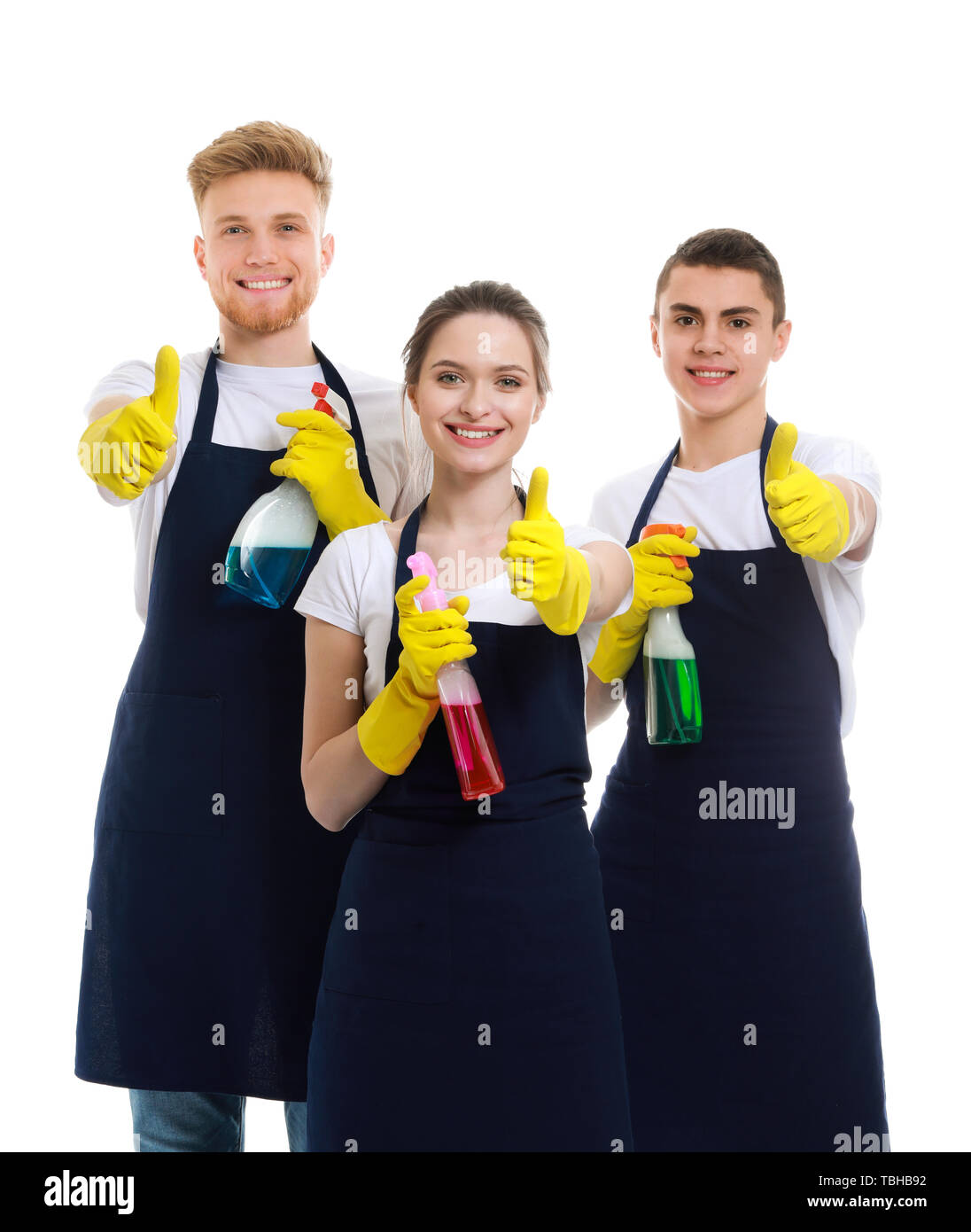 Team of janitors showing thumb-up gesture on white background Stock ...