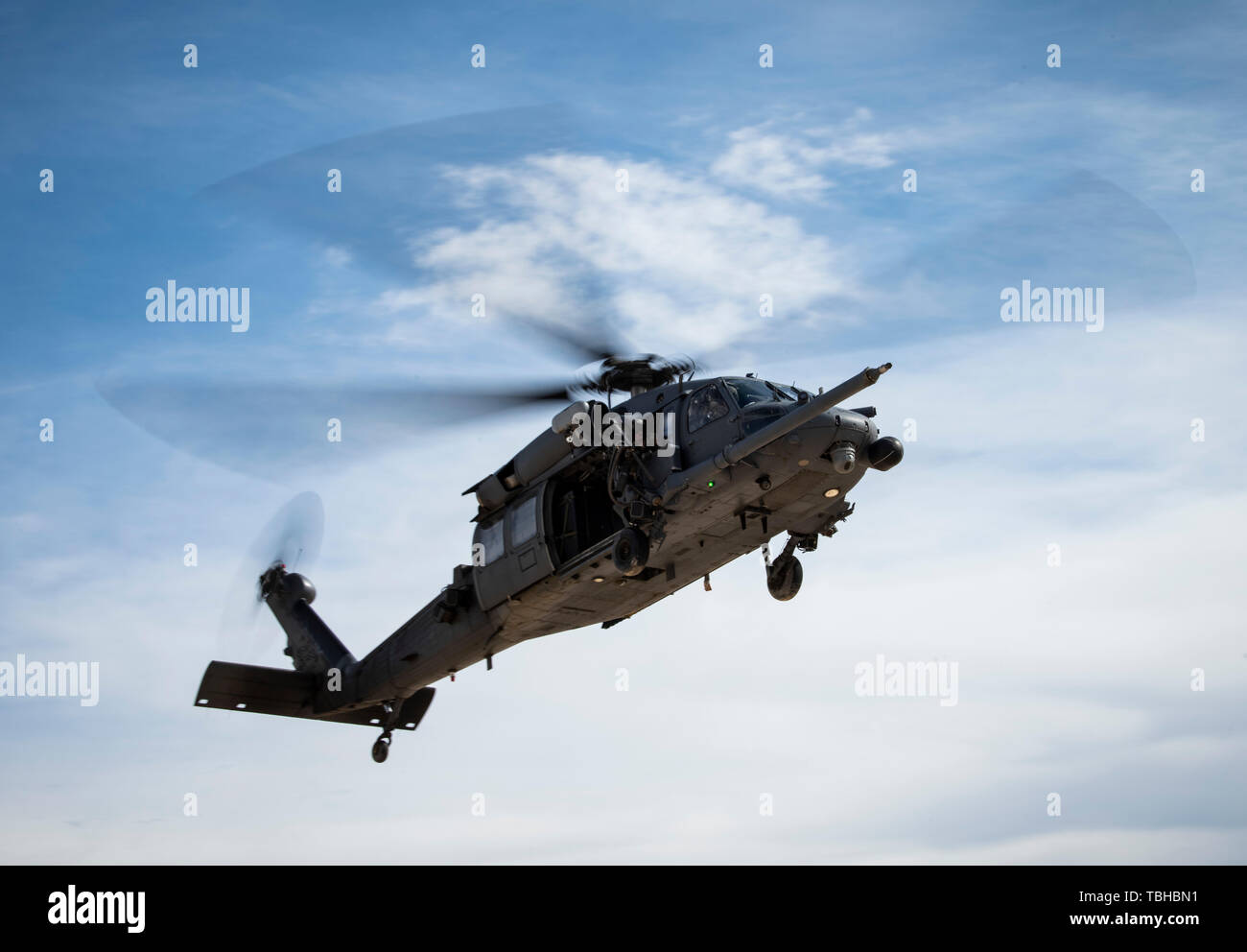 A HH-60G Pave Hawk helicopter assigned to the 34th Weapons School flies ...