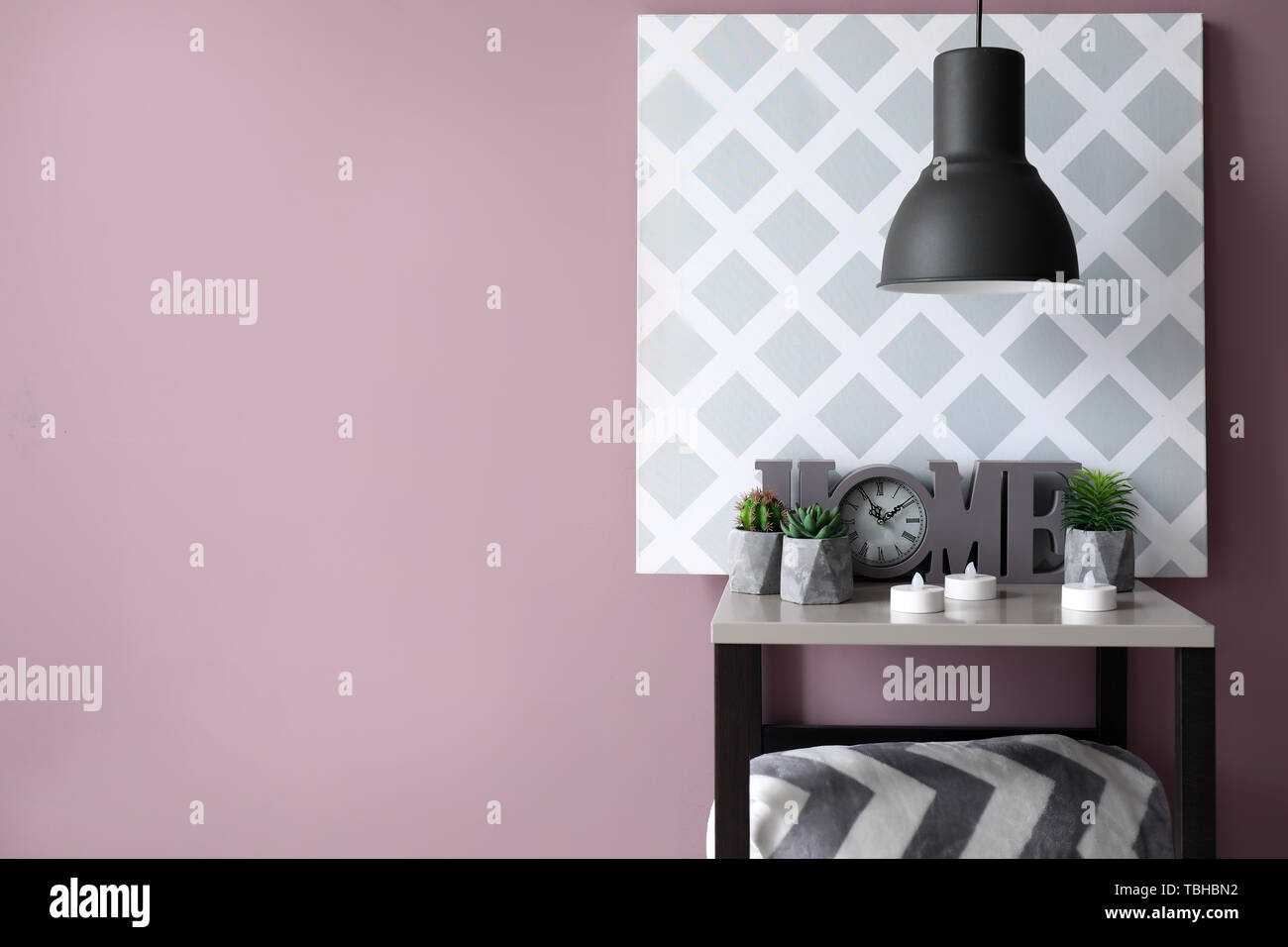 Interior of room with table and color wall Stock Photo - Alamy