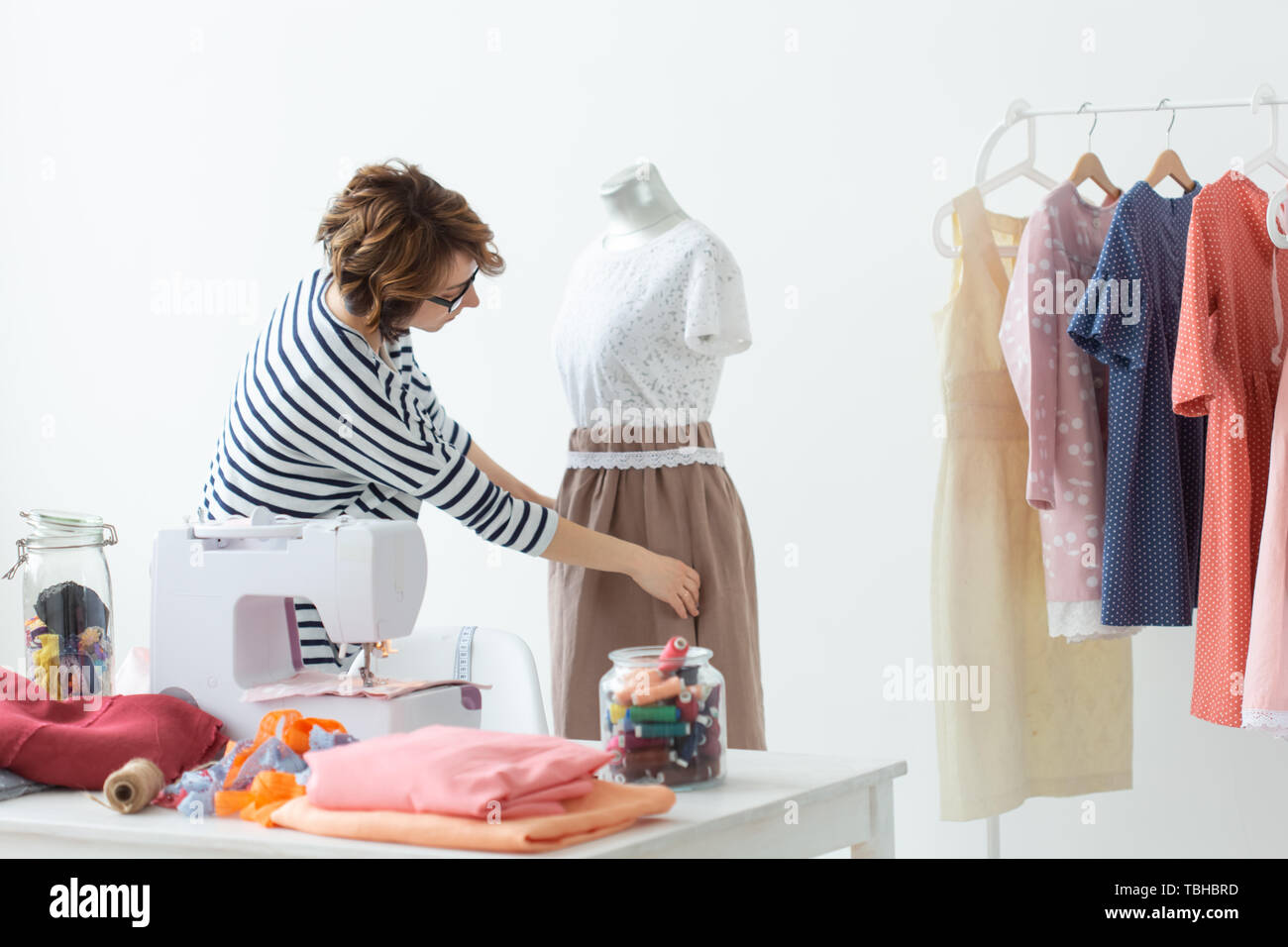 Fashion designer, seamstress and Small-Sized Enterprises concept ...