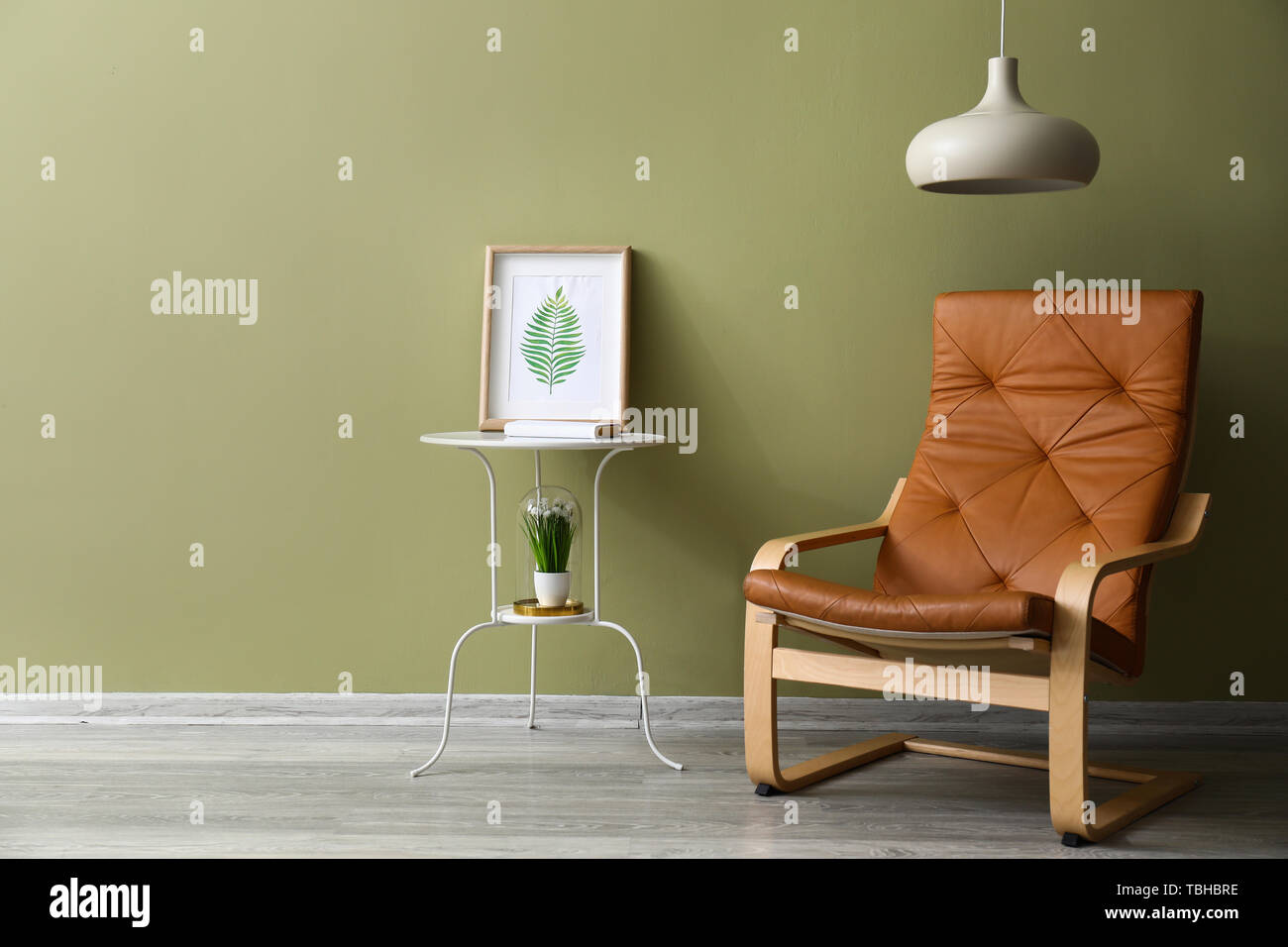 Interior of room with table and armchair Stock Photo - Alamy