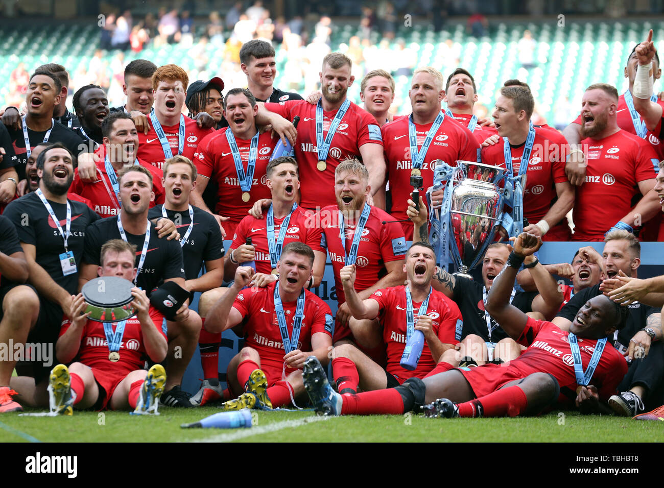 Saracens players lift the trophy following victory in the Gallagher ...