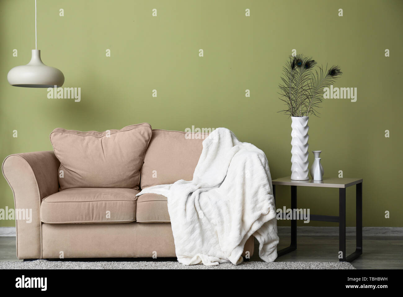 Interior of room with sofa and table Stock Photo - Alamy