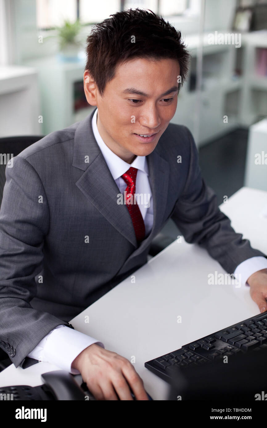 A manager works in an office Stock Photo - Alamy