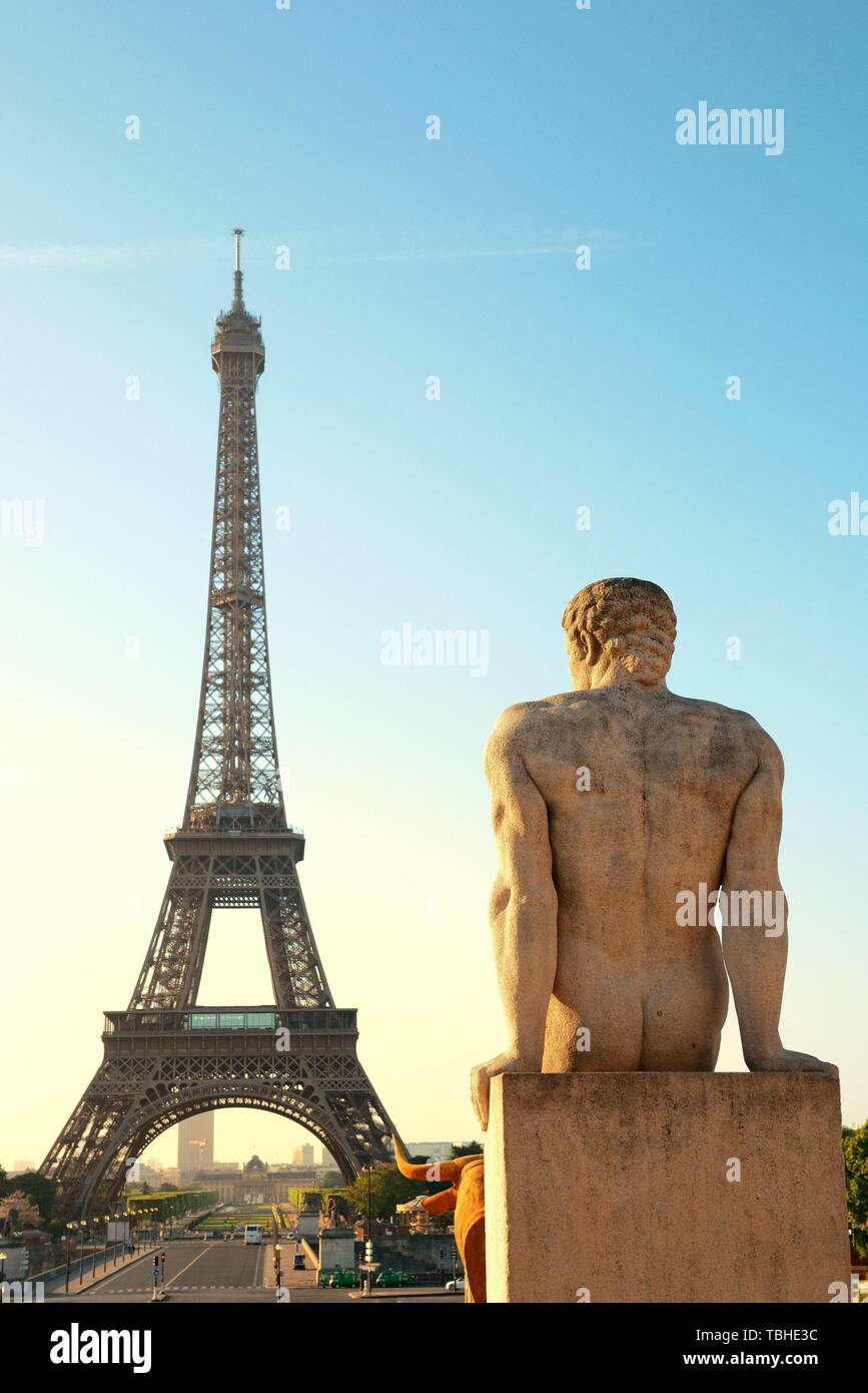 Eiffel Tower with statue as the famous city landmark in Paris Stock ...